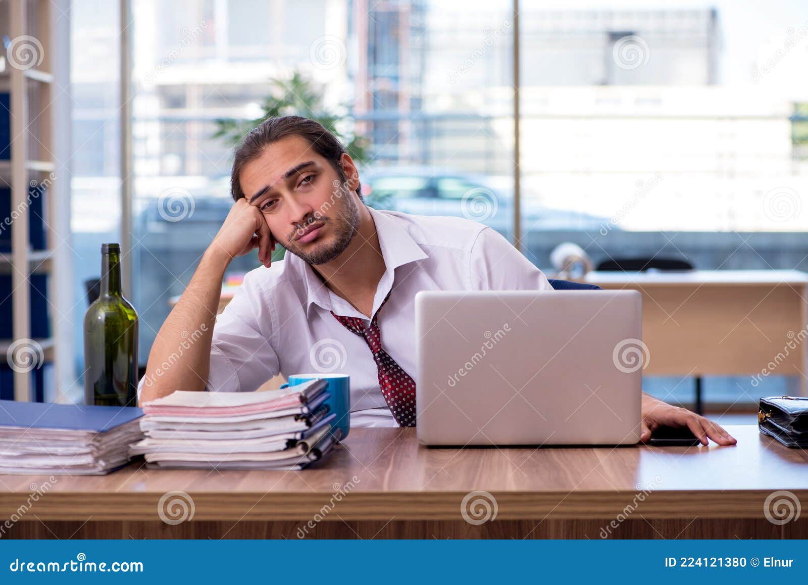 Young Male Alcohol Addicted Employee Working in the Office Stock Photo ...