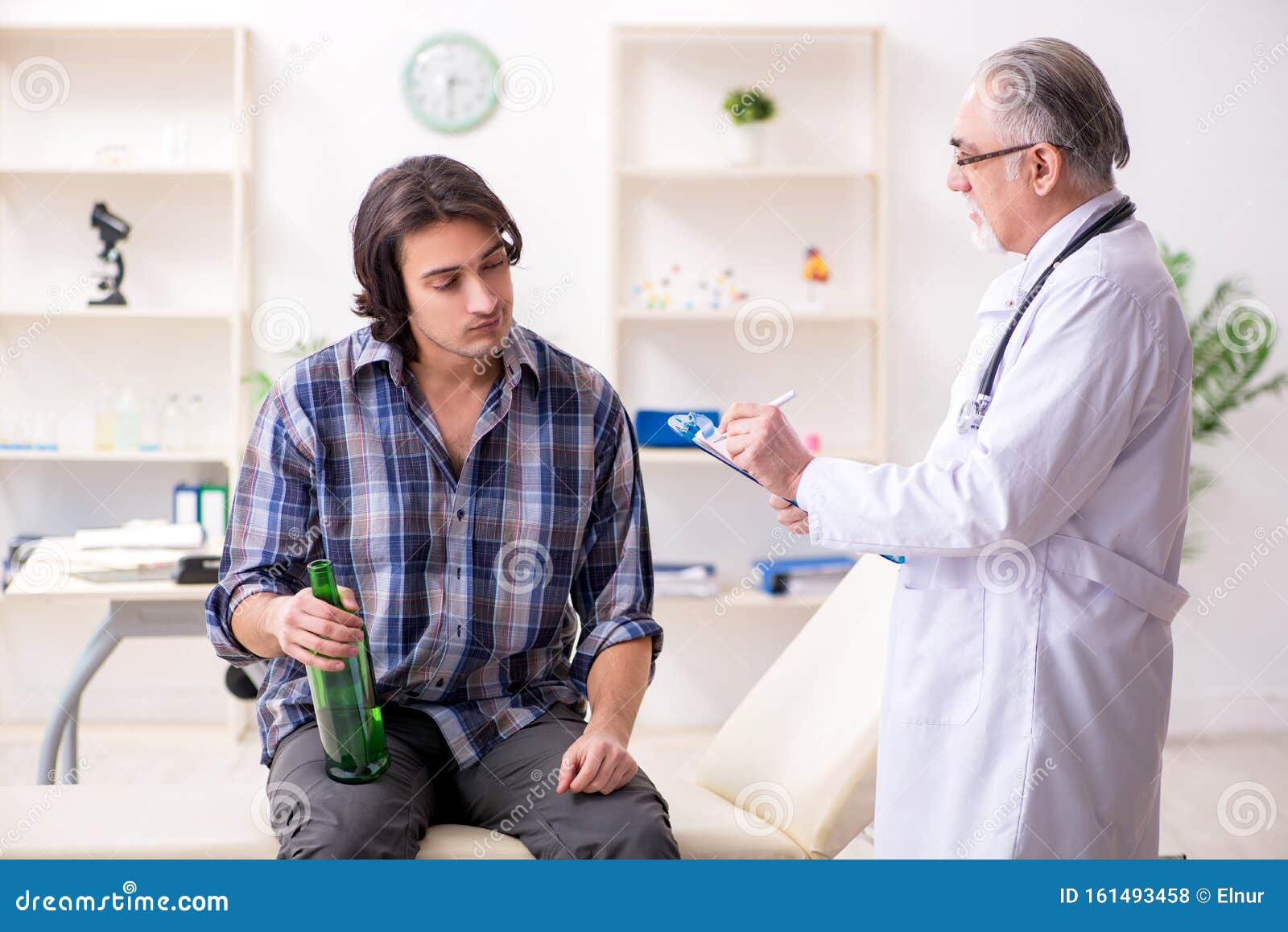 Young Male Alcoholic Visiting Old Doctor Stock Photo - Image of doctor ...