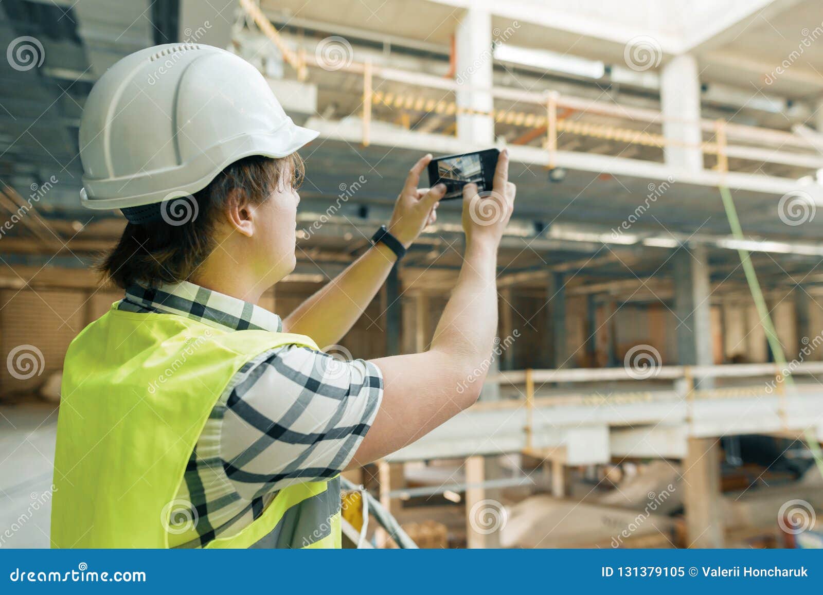 Young Male Architect Photographs a Construction Site. Building ...