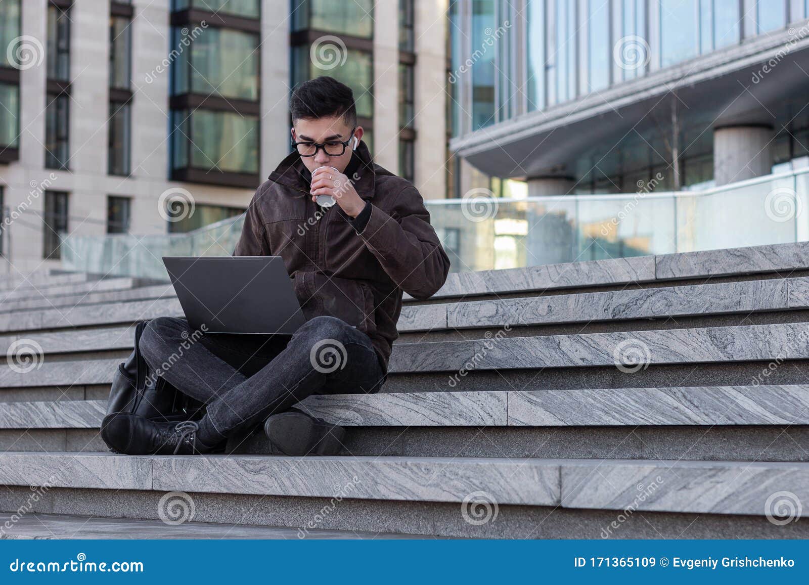 Young Male Asian Student Programmer Freelancer Work Outdoors with ...