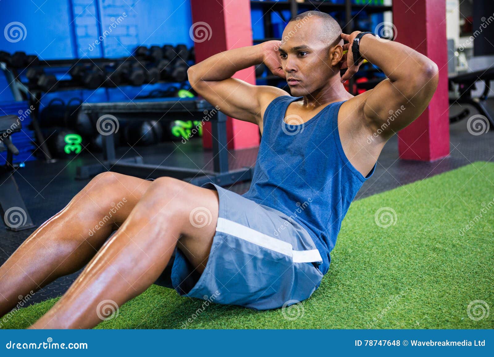 Young Male Athlete with Hands Behind Back in Gym Stock Photo - Image of ...