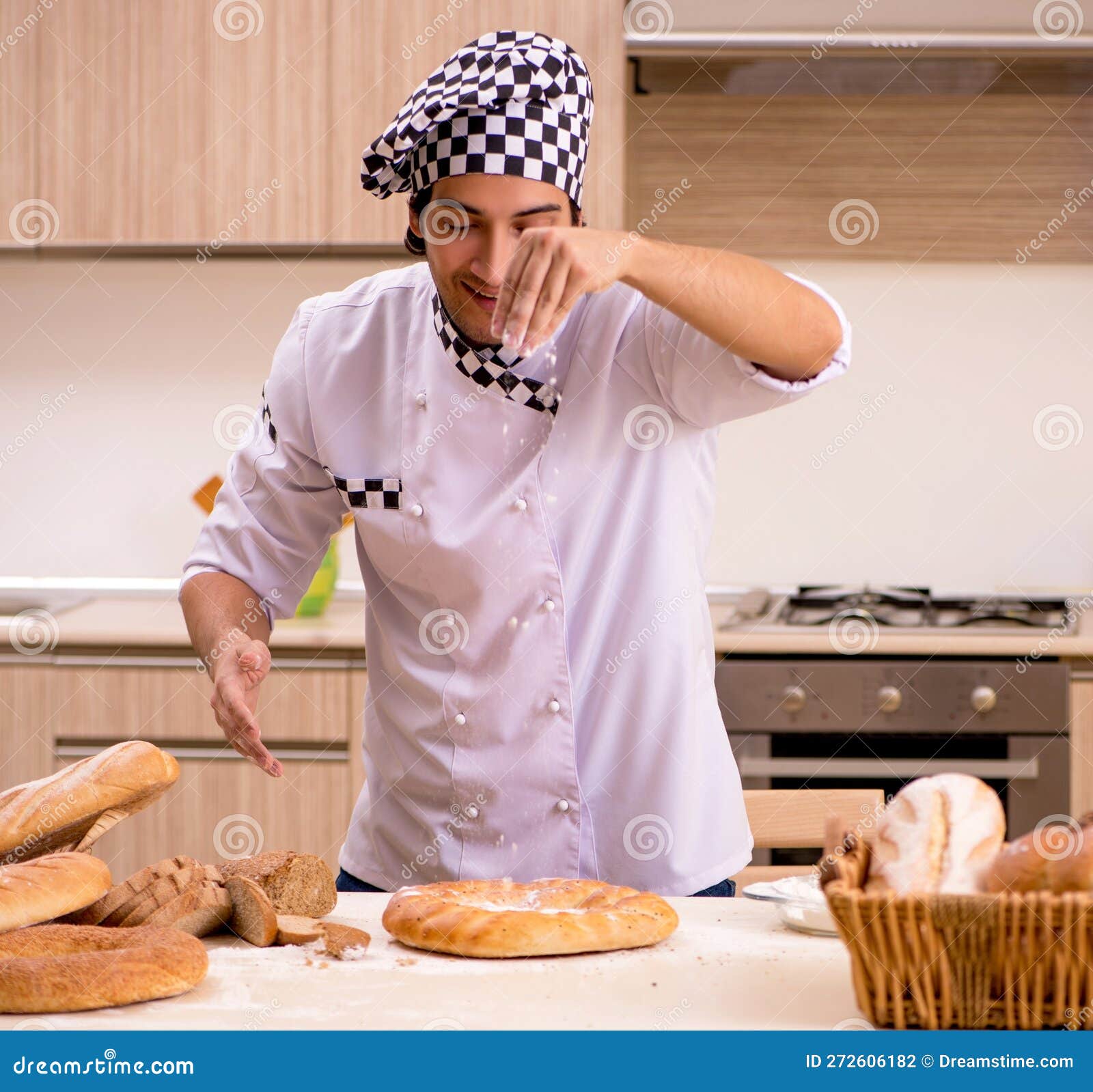 Young Male Baker Working in Kitchen Stock Photo - Image of cheerful ...