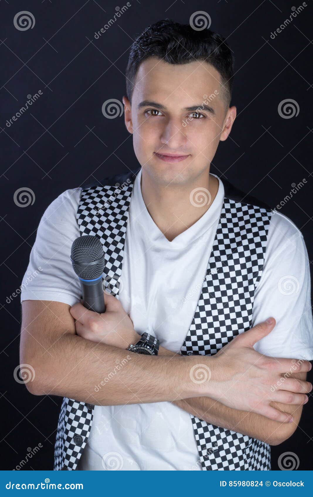 Young Male Black-haired Pop Singer Performs Singing To Microphone Stock ...