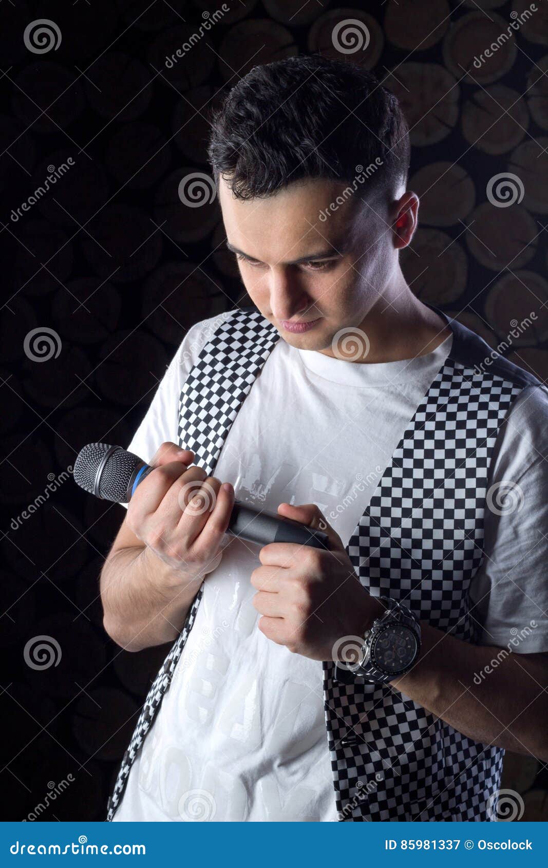 Young Male Black-haired Singer Performs with Microphone Stock Image ...