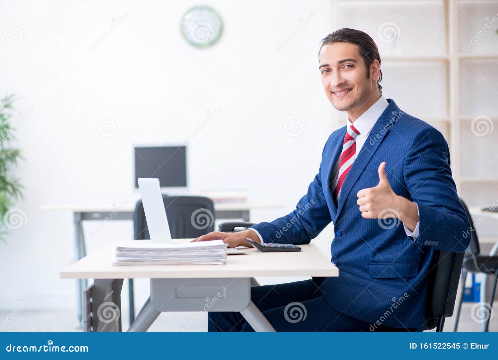 Young Male Businessman Sitting in the Office Stock Image - Image of ...