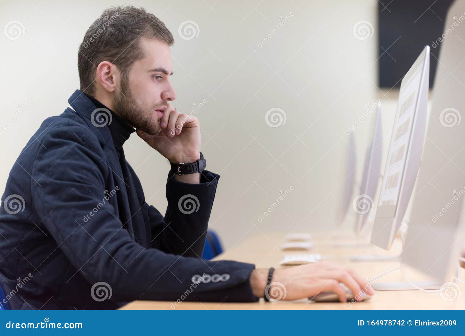 Young Male Businessman Working on Modern Computer. Businessman Using ...