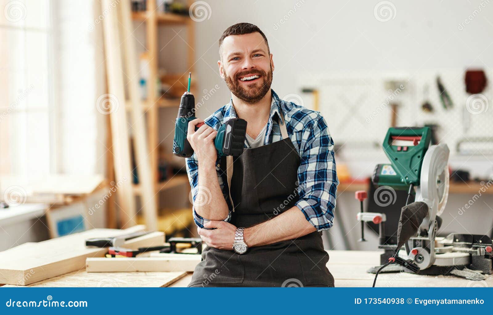 Young Male Carpenter with Screwdriver Working in Workshop Stock Photo ...