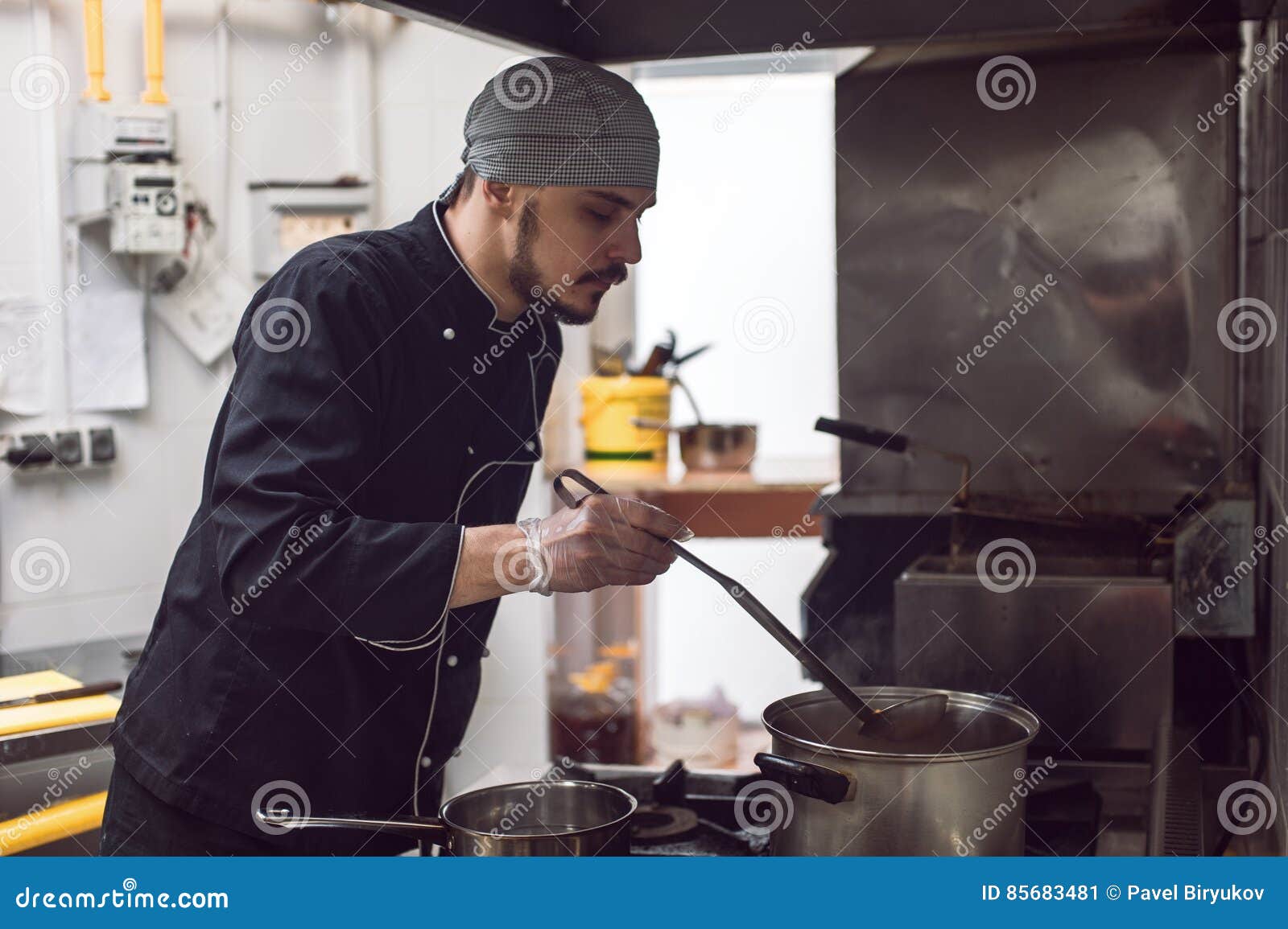 Young Male Chef Cooking in Restaraunt Kitchen Stock Image - Image of ...