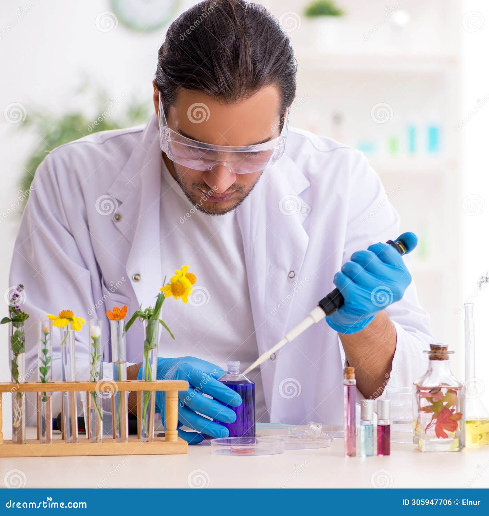 Young Male Chemist in Perfume Synthesis Concept Stock Photo - Image of ...