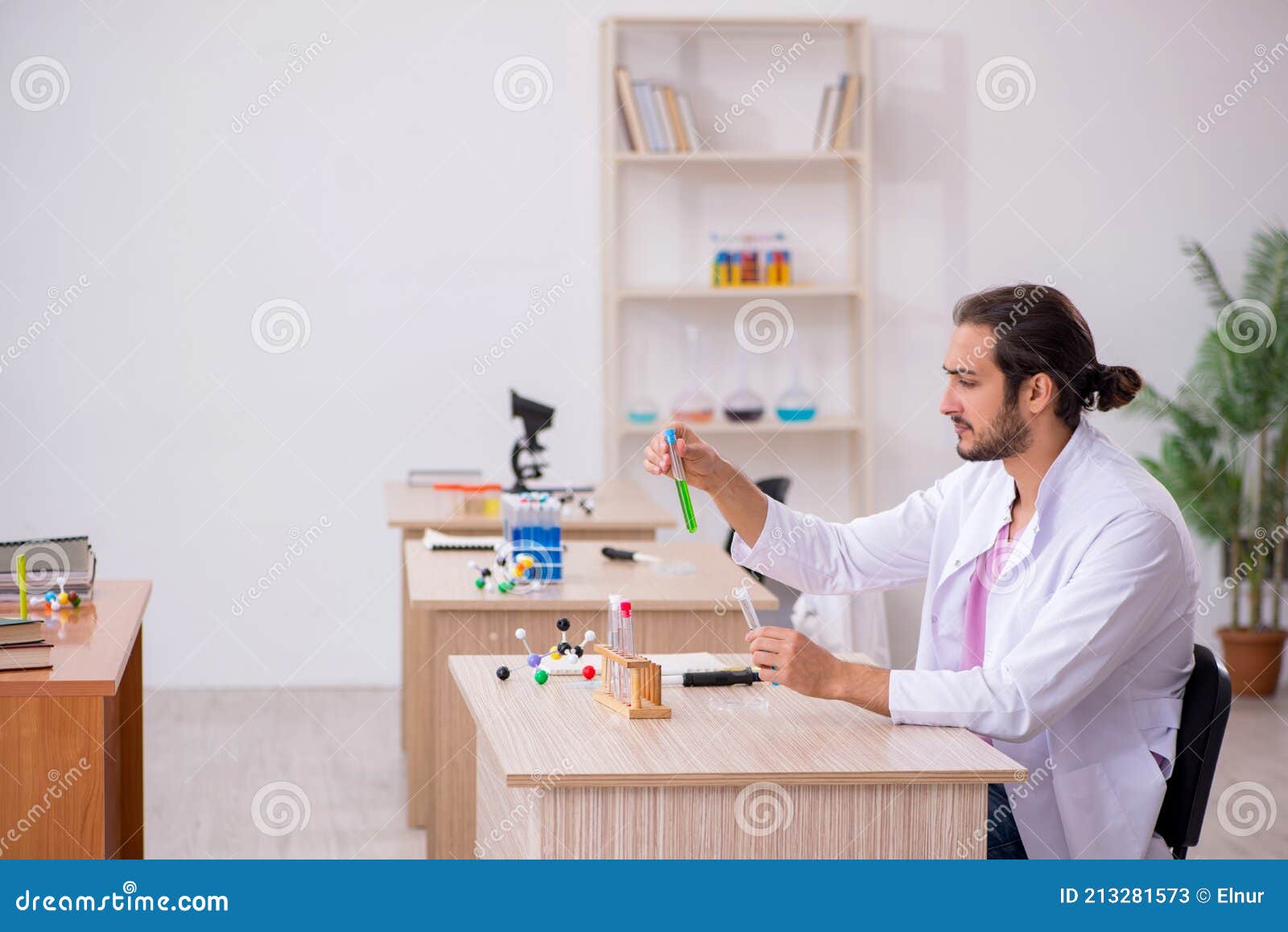 Young Male Chemist Sitting at the Desk in the Classroom Stock Image ...