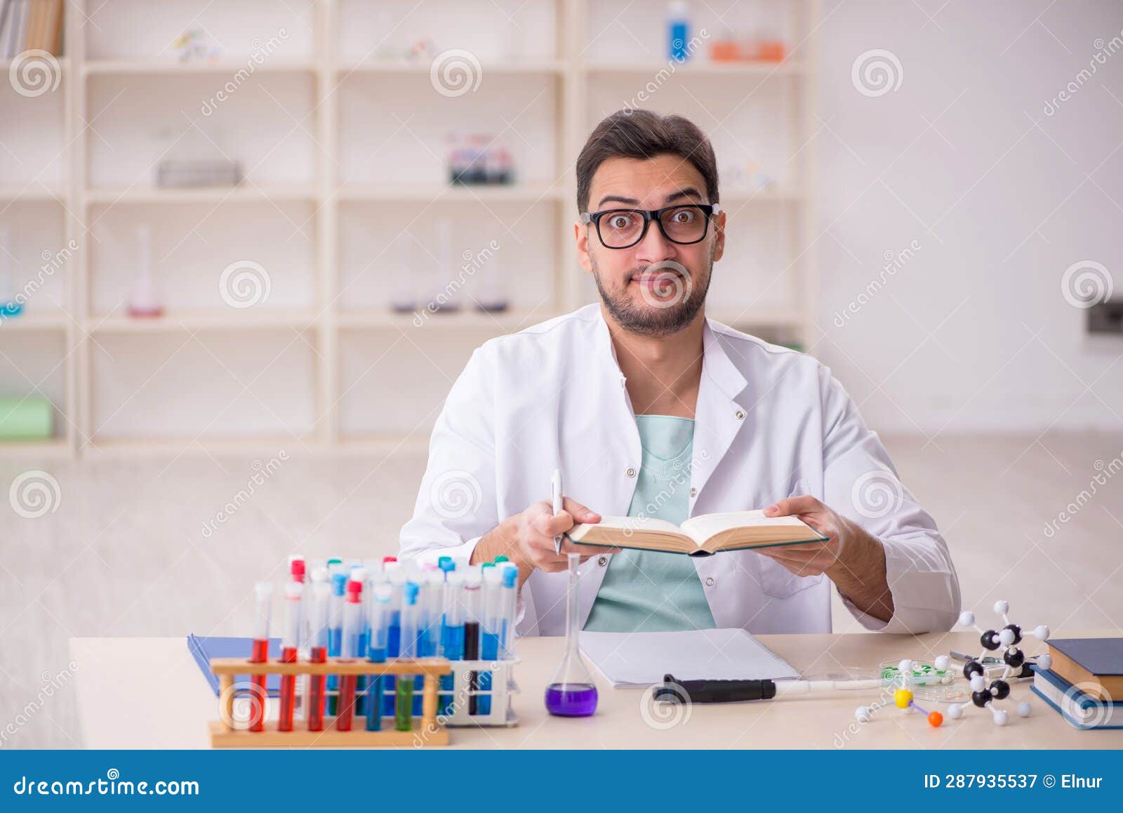 Young Male Chemist Sitting at the Lab Stock Image - Image of chemist ...