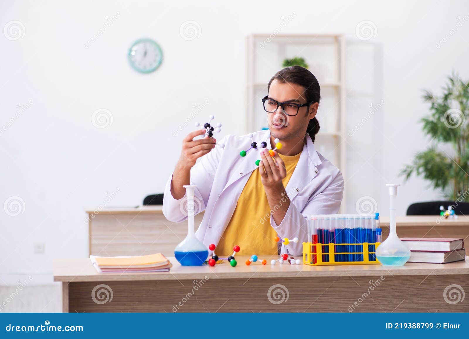 Young Male Chemist Studying Molecular Model in the Classroom Stock ...