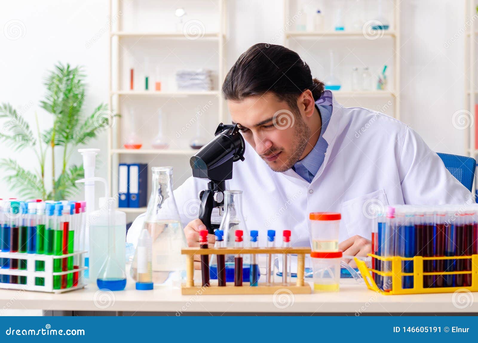 The Young Male Chemist Working in the Lab Stock Image - Image of ...