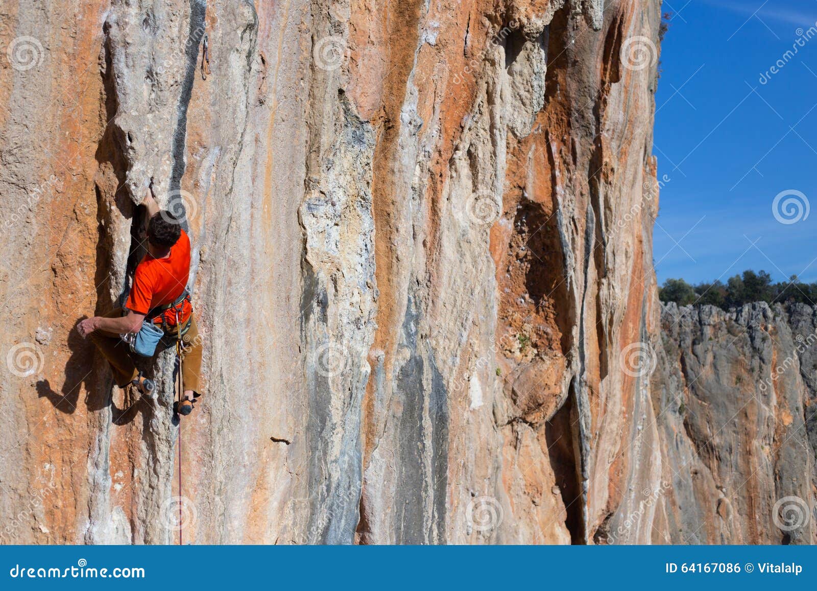 Young Male Climber Hanging by a Cliff. Stock Photo - Image of climbing ...