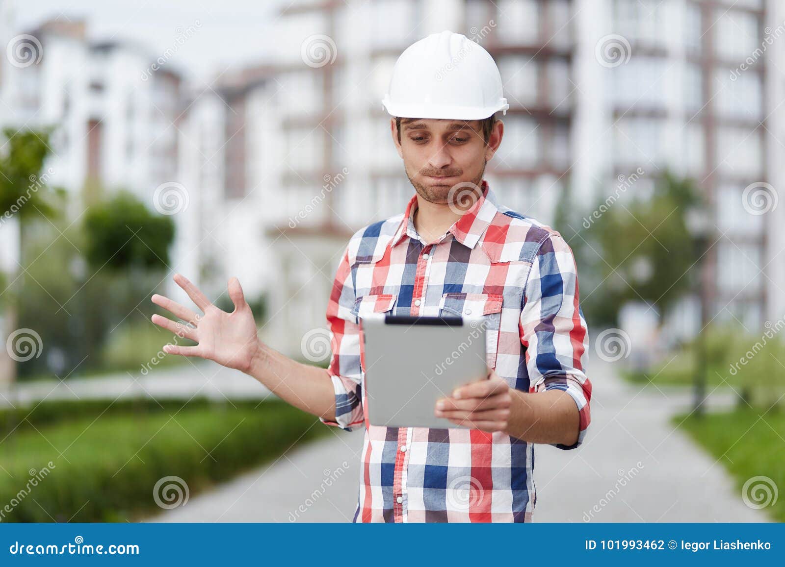 Young Architect in Front of Apartment Building Stock Photo - Image of ...