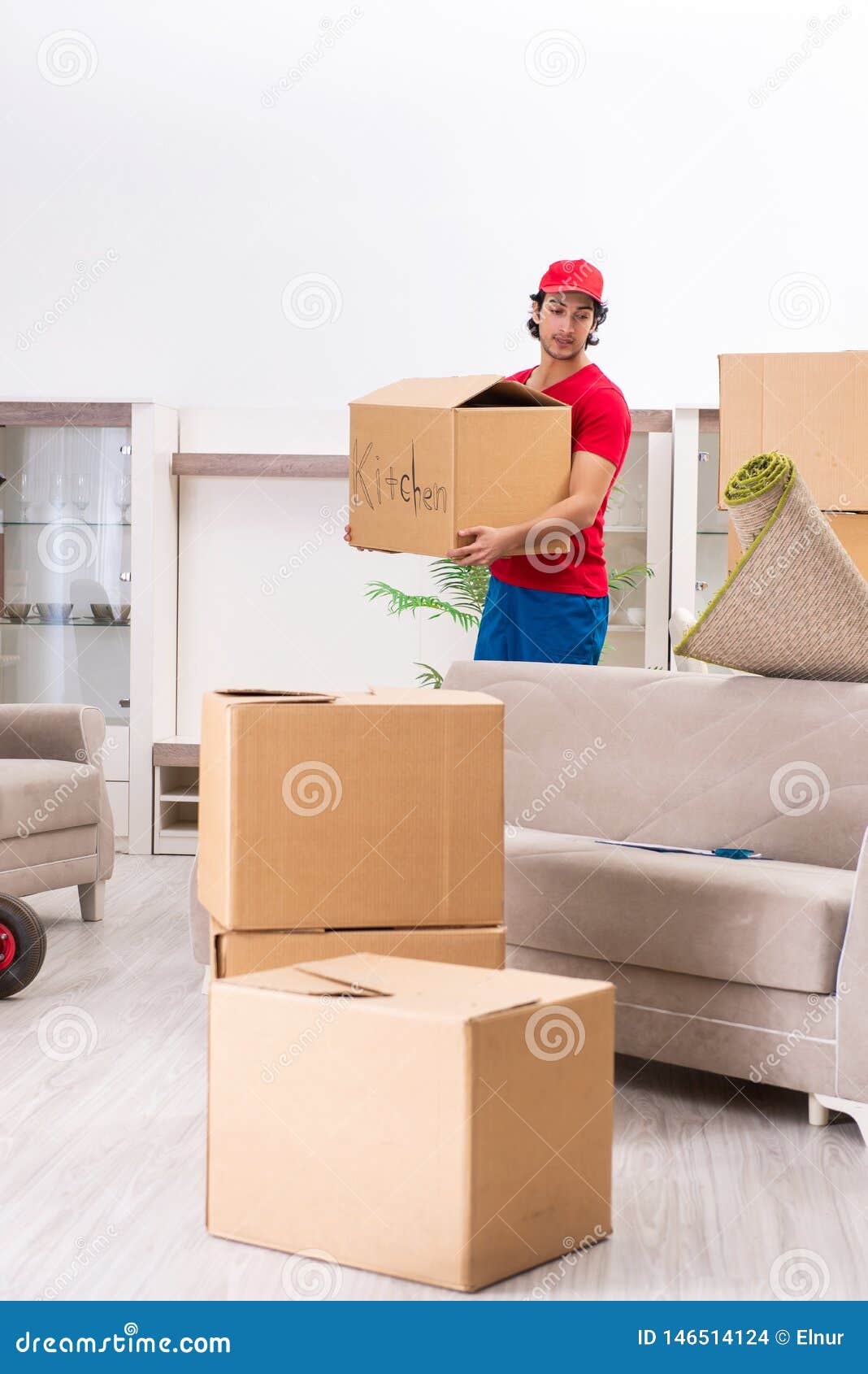 The Young Male Contractor with Boxes Working Indoors Stock Photo ...