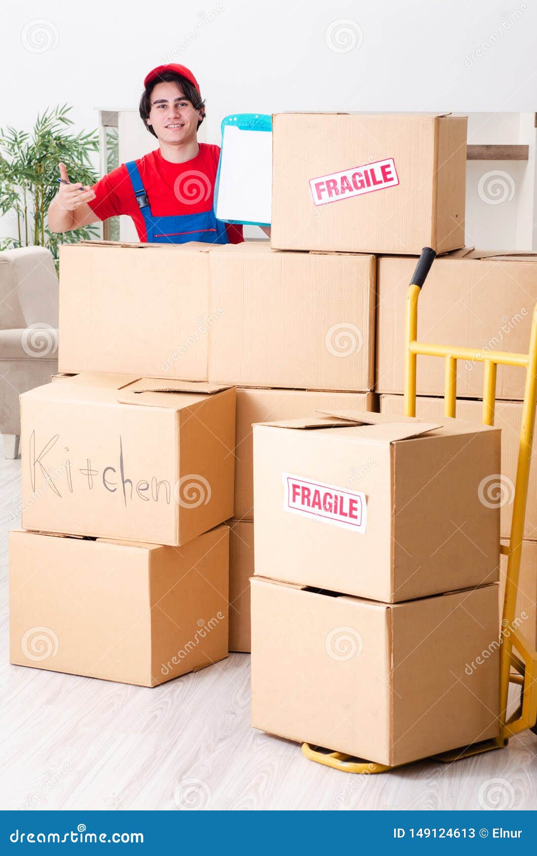 The Young Male Contractor with Boxes Working Indoors Stock Image ...