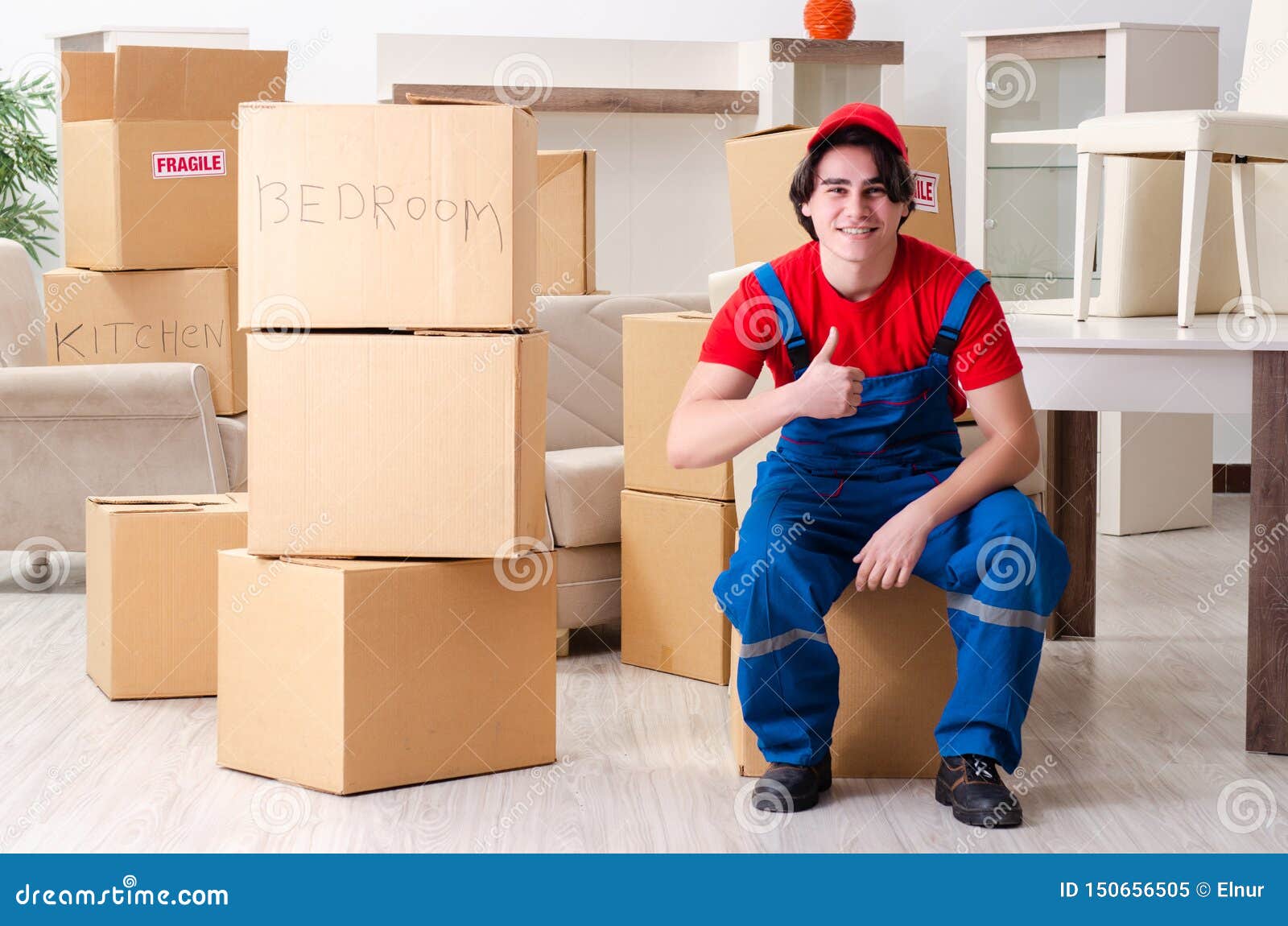 The Young Male Contractor with Boxes Working Indoors Stock Image ...