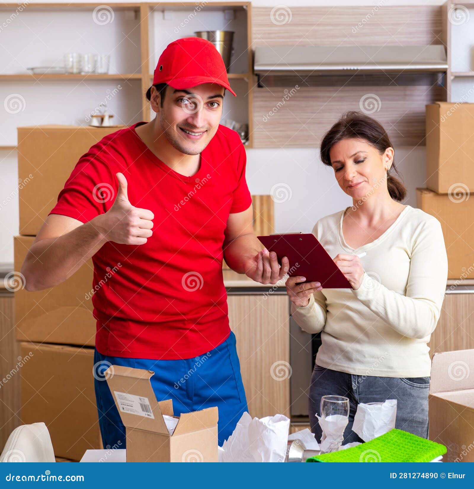 Young Male Contractor and Female Customer in Moving Concept Stock Photo - Image of flat ...