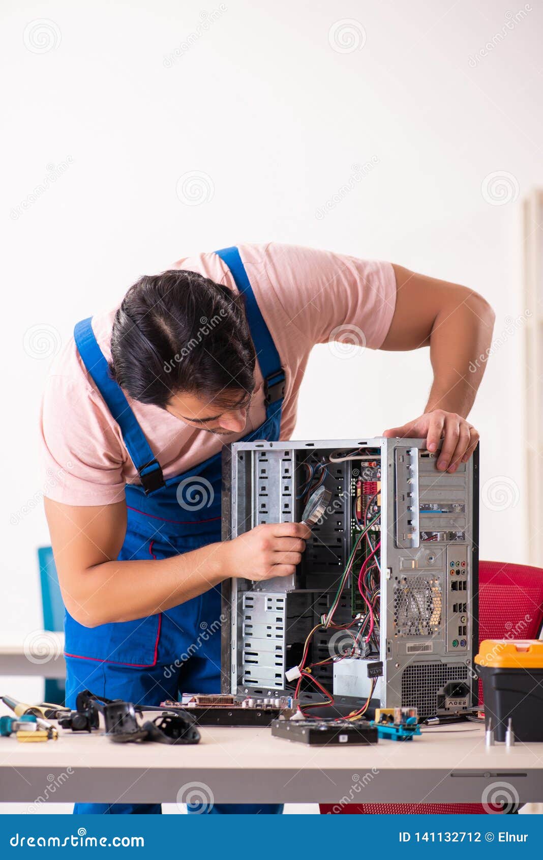 The Young Male Contractor Repairing Computer Stock Photo - Image of ...