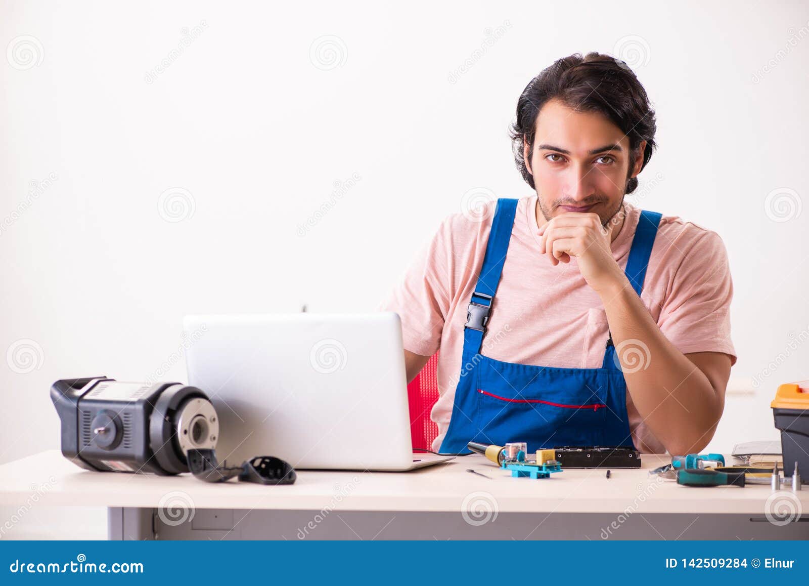 The Young Male Contractor Repairing Computer Stock Photo - Image of ...