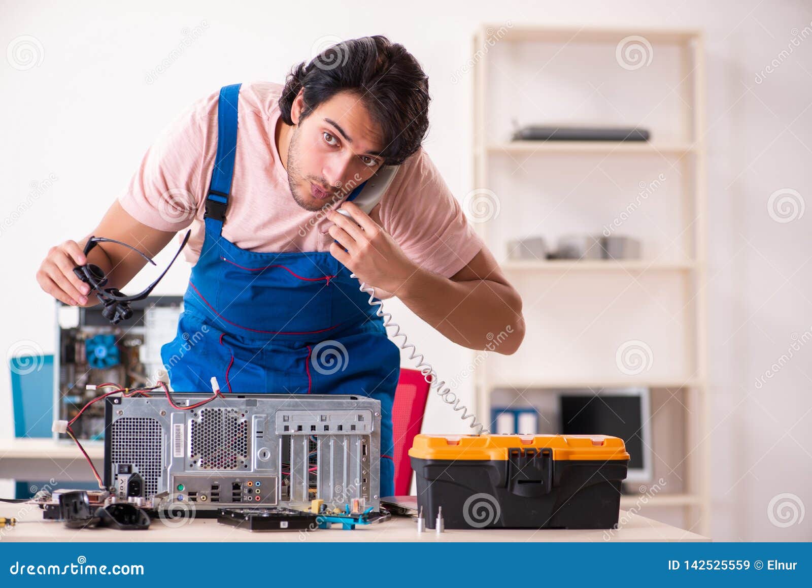 The Young Male Contractor Repairing Computer Stock Image - Image of ...