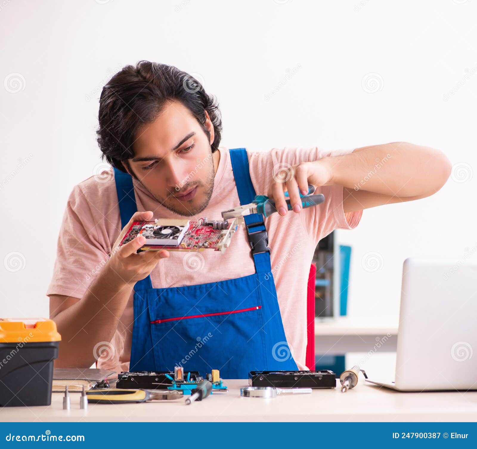 The Young Male Contractor Repairing Computer Stock Image - Image of ...