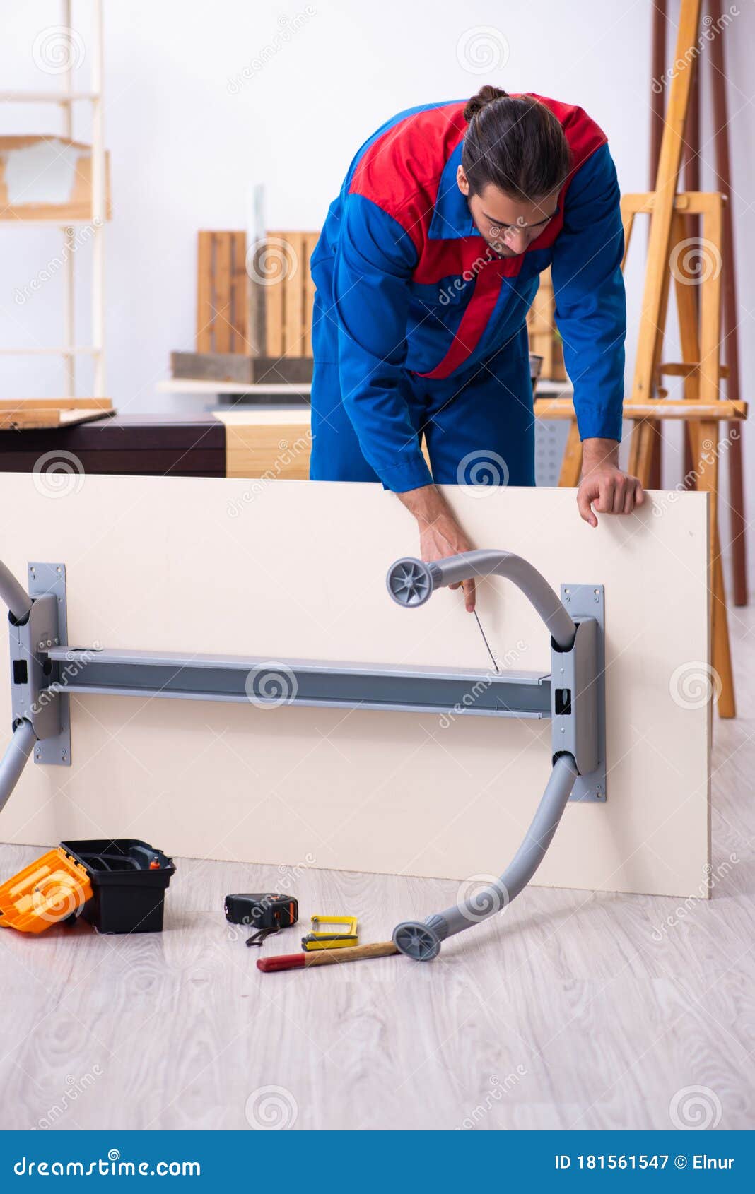 Young Male Contractor Working in Workshop Stock Image - Image of ...