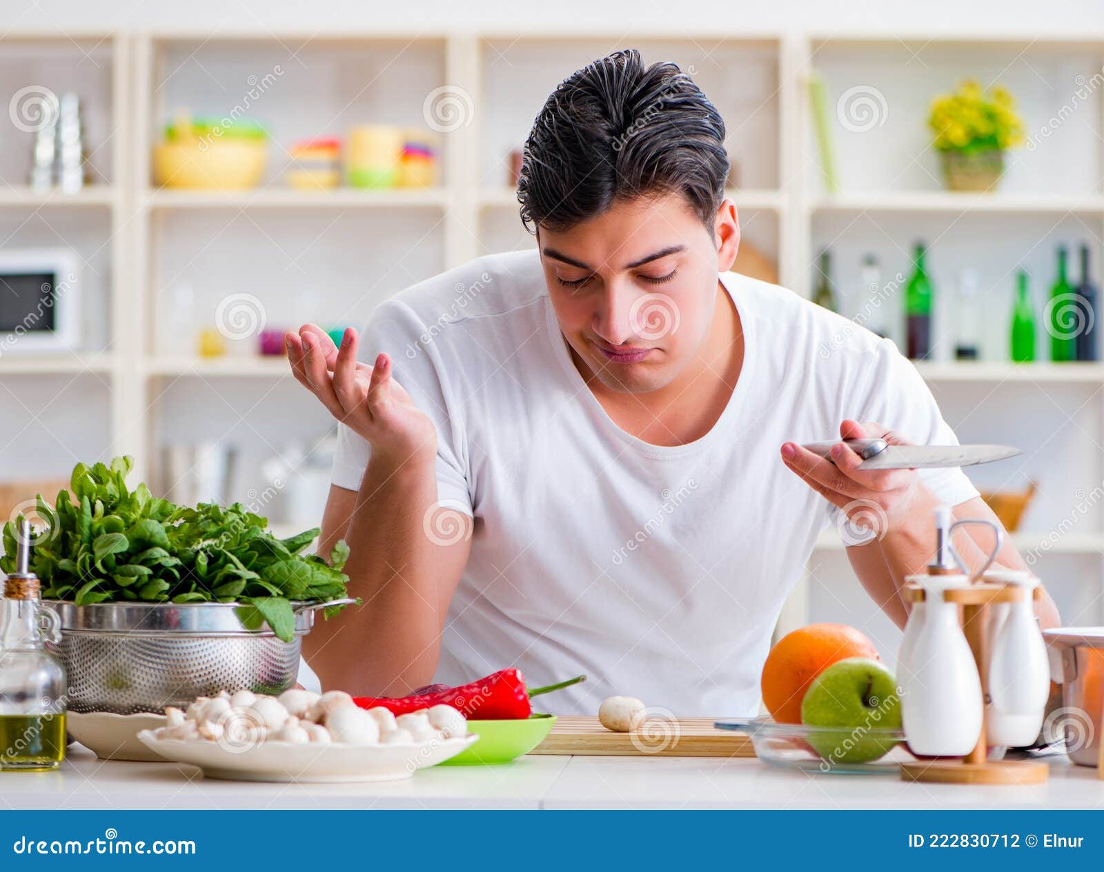 Young Male Cook Working in the Kitchen Stock Photo - Image of herbs ...