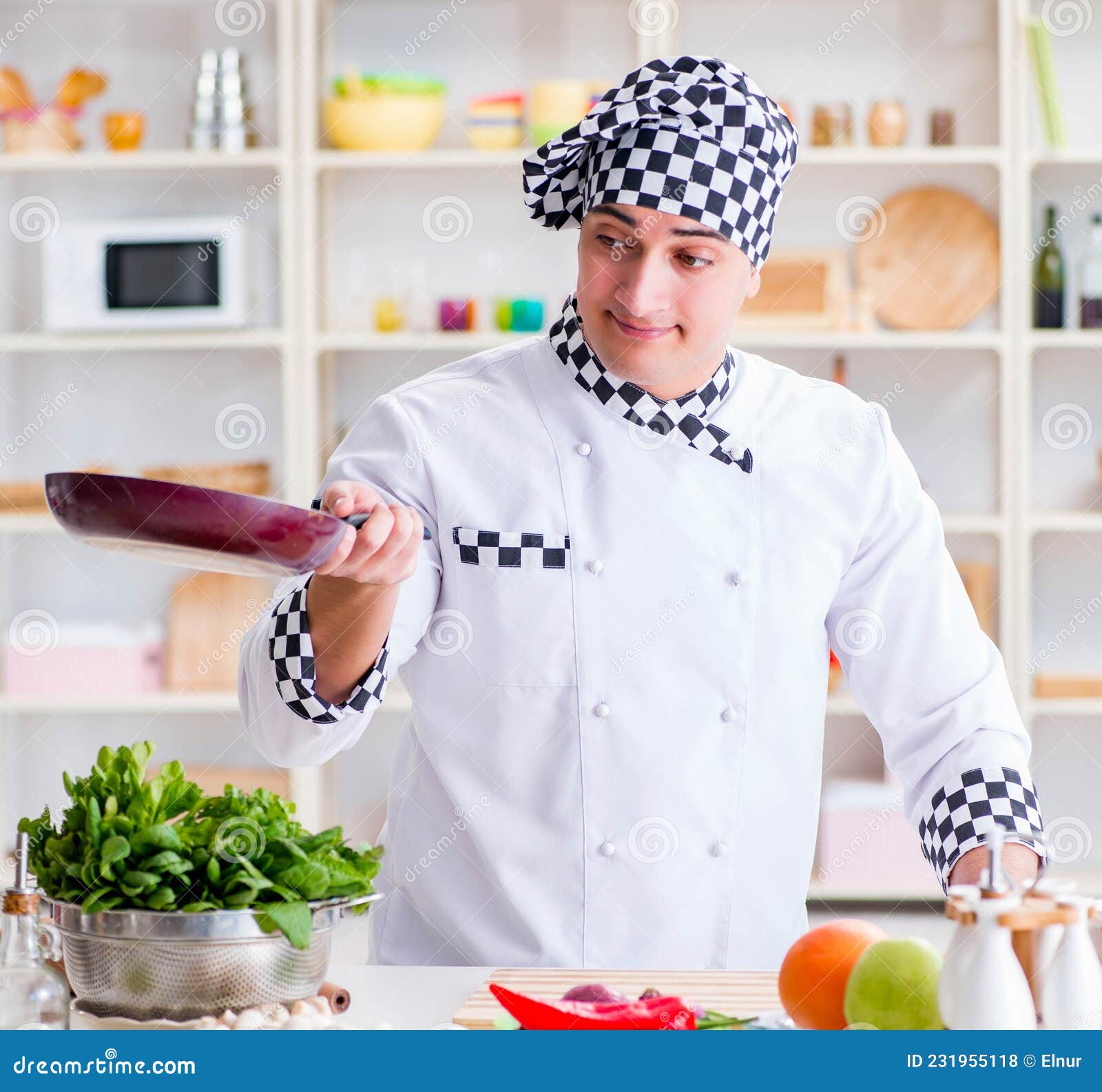 Young Male Cook Working in the Kitchen Stock Photo - Image of green ...