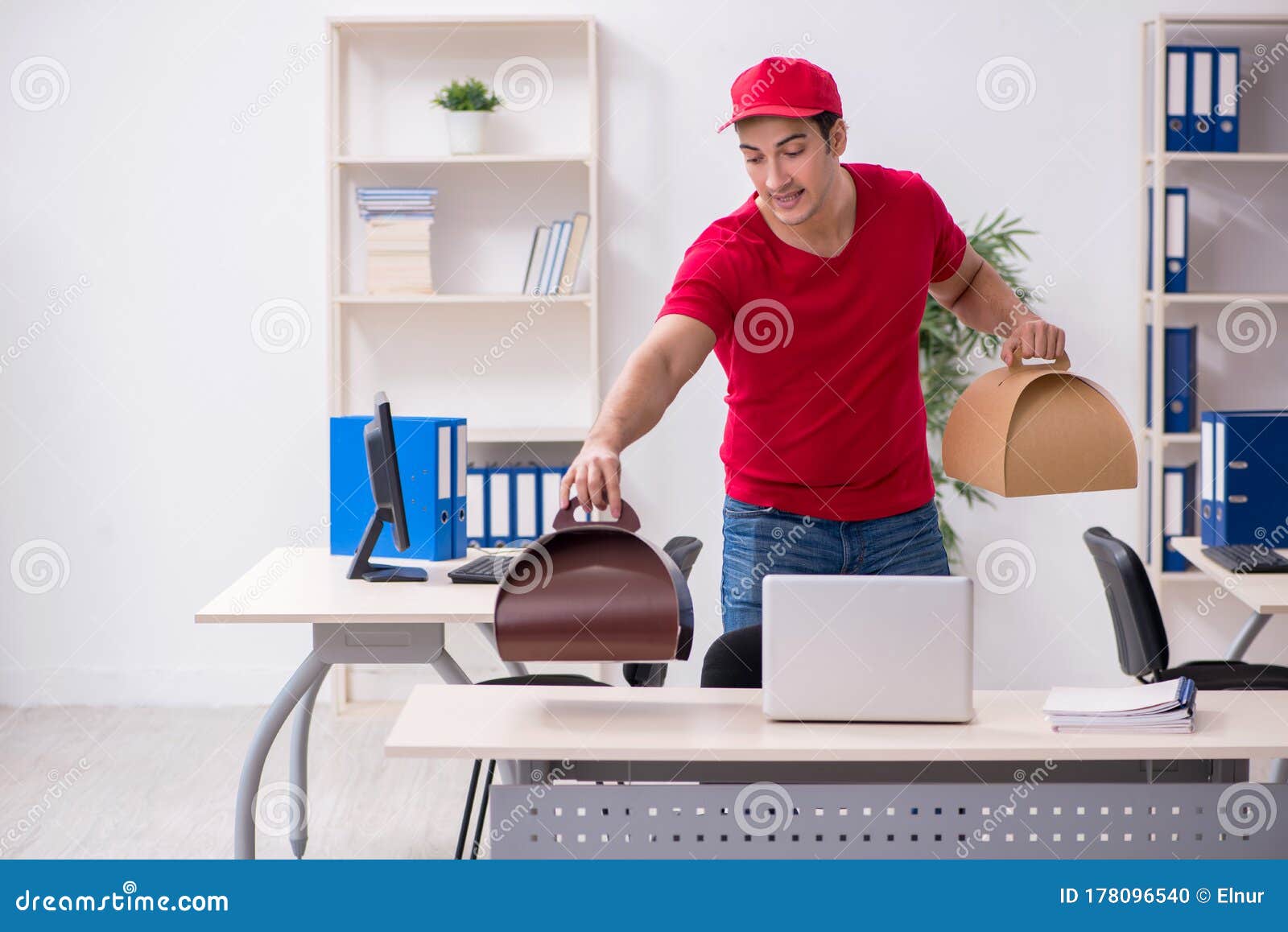 Young Male Courier Delivering Cake To the Office Stock Photo - Image of ...