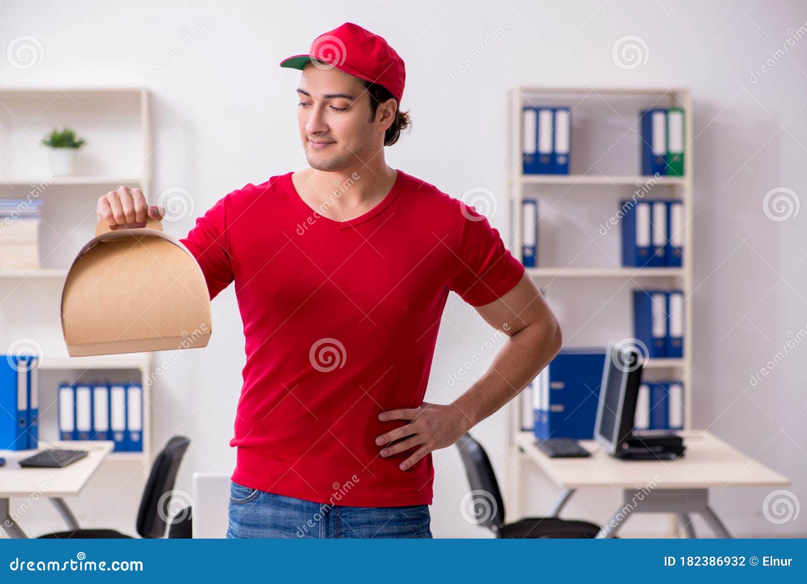 Young Male Courier Delivering Cake To the Office Stock Photo - Image of ...