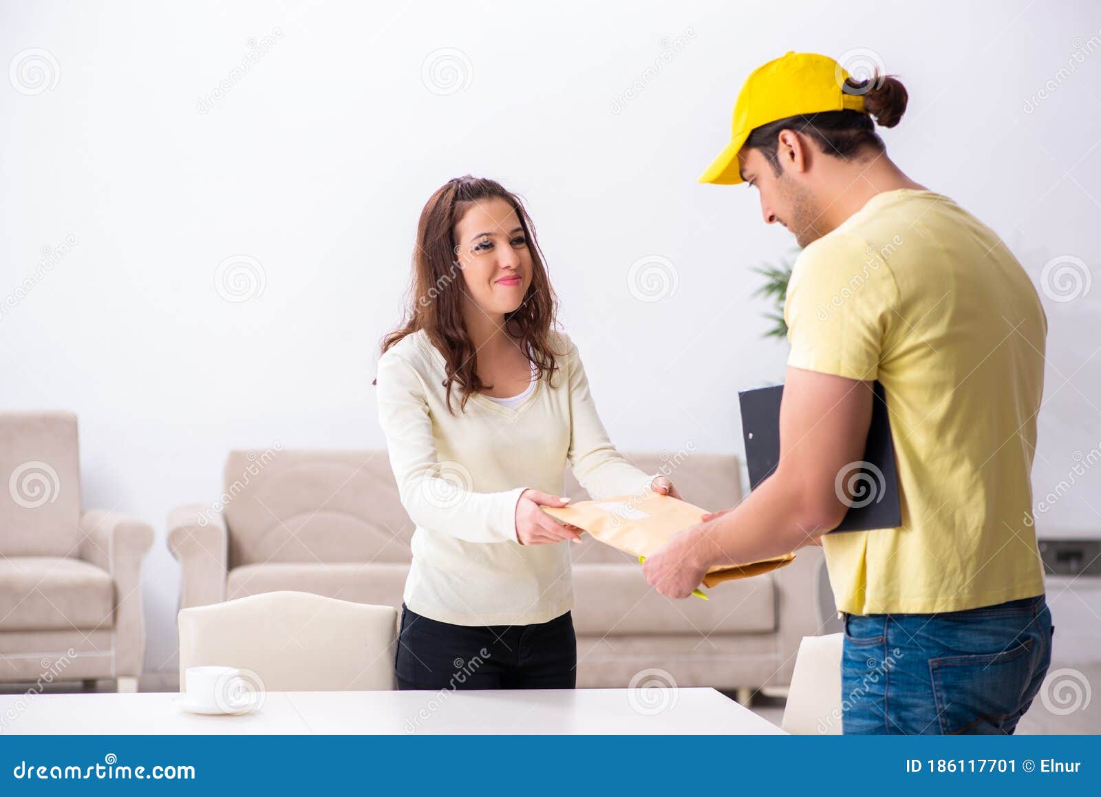Young Male Courier Delivering Parcel To the Office Stock Image - Image ...