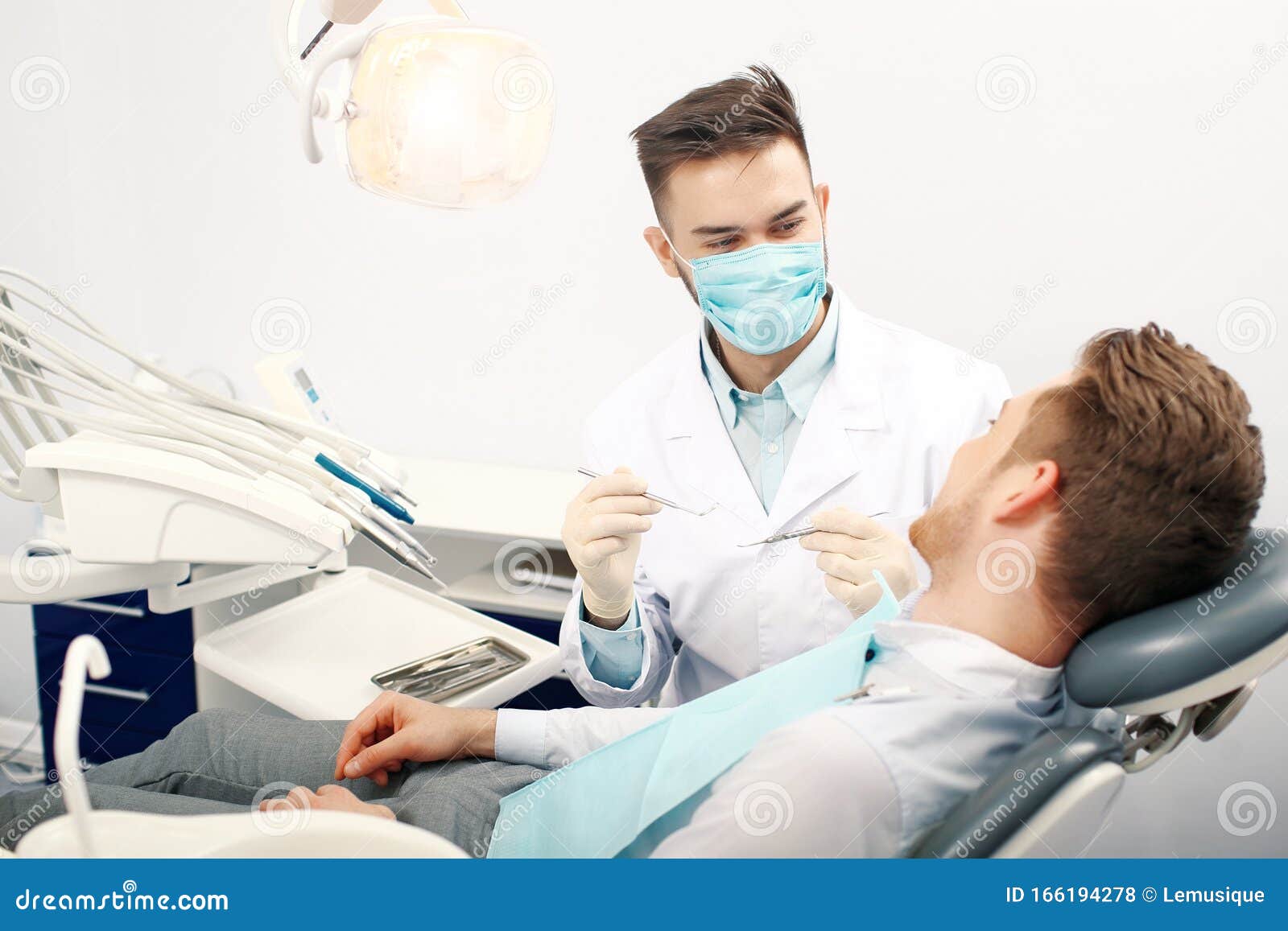 Dentist With A Patient Guy Portrait In Dental Room Royalty-Free Stock ...