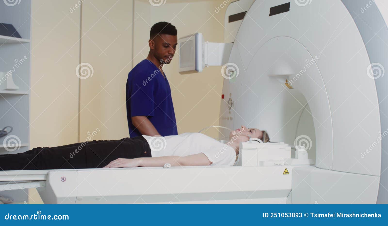 The Medic Sending the Patient into the Tunnel for Brain MRI Stock Video ...