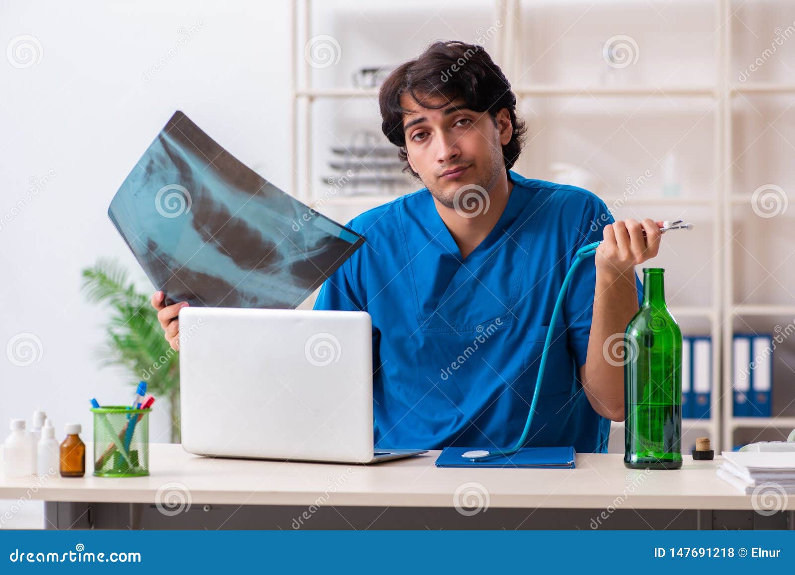 The Young Male Doctor Drinking in the Office Stock Photo - Image of ...