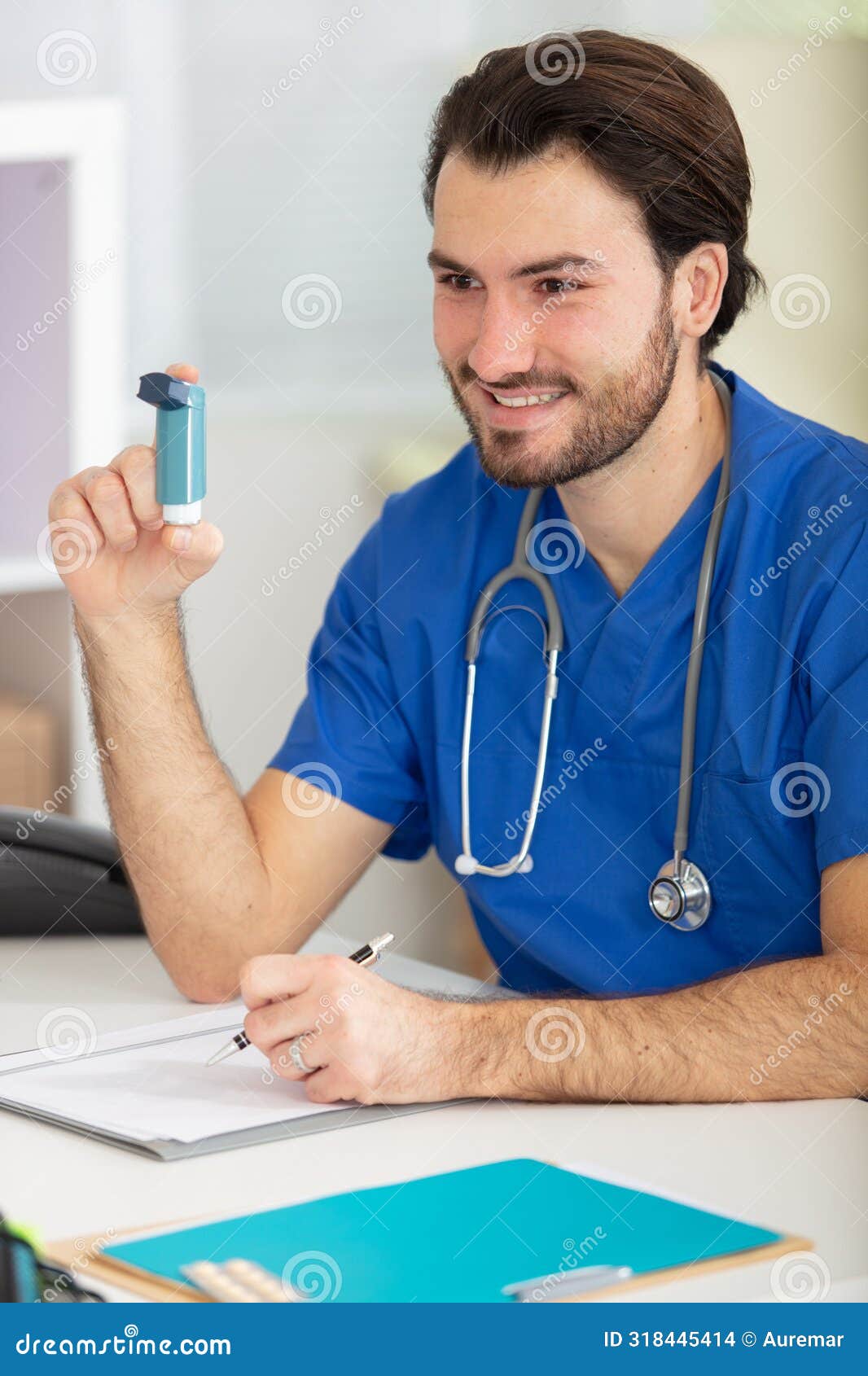 Young Male Doctor Giving Information on Using Inhaler Stock Photo ...