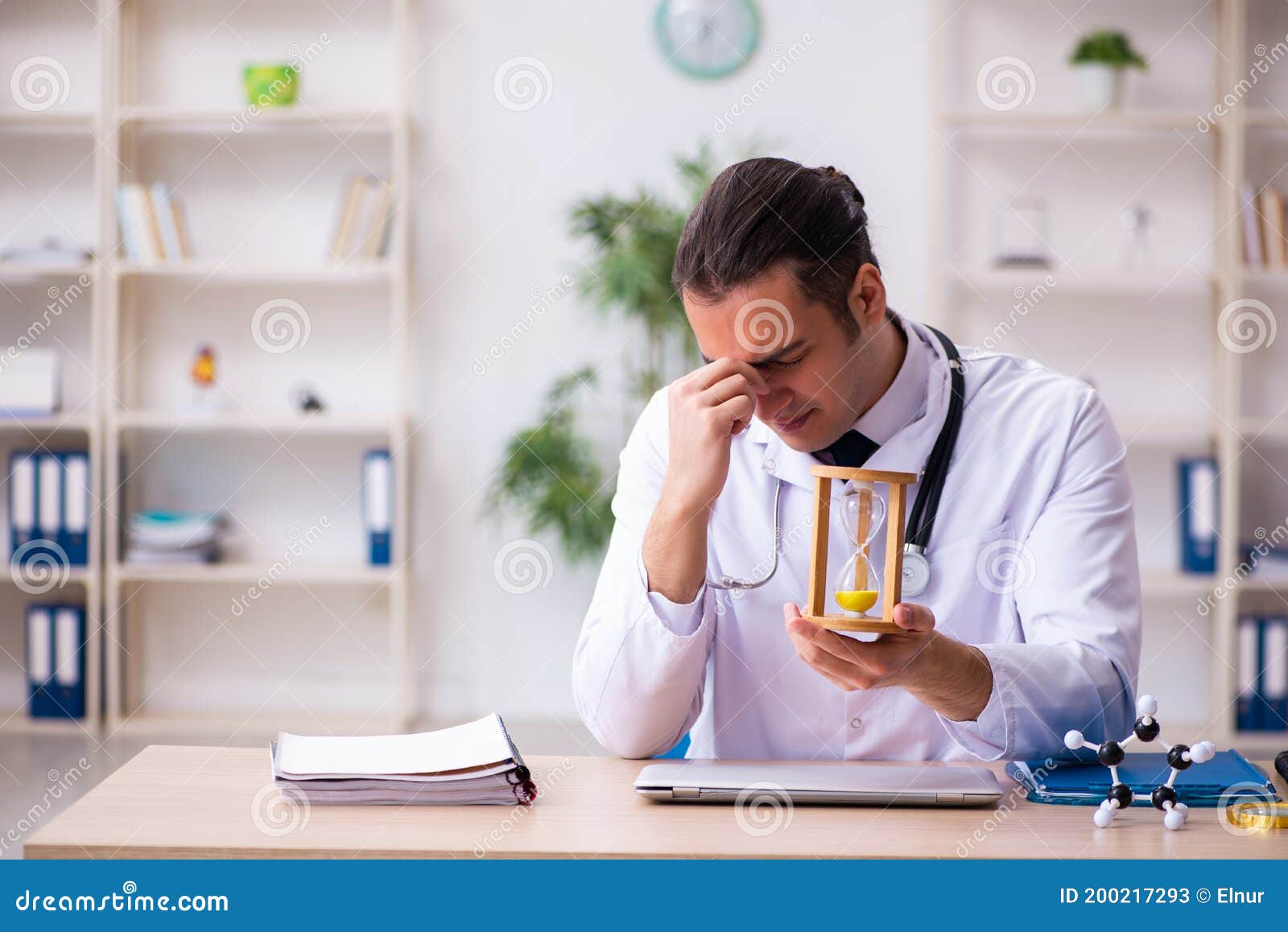 Young Male Doctor in Time Management Concept Stock Image - Image of ...