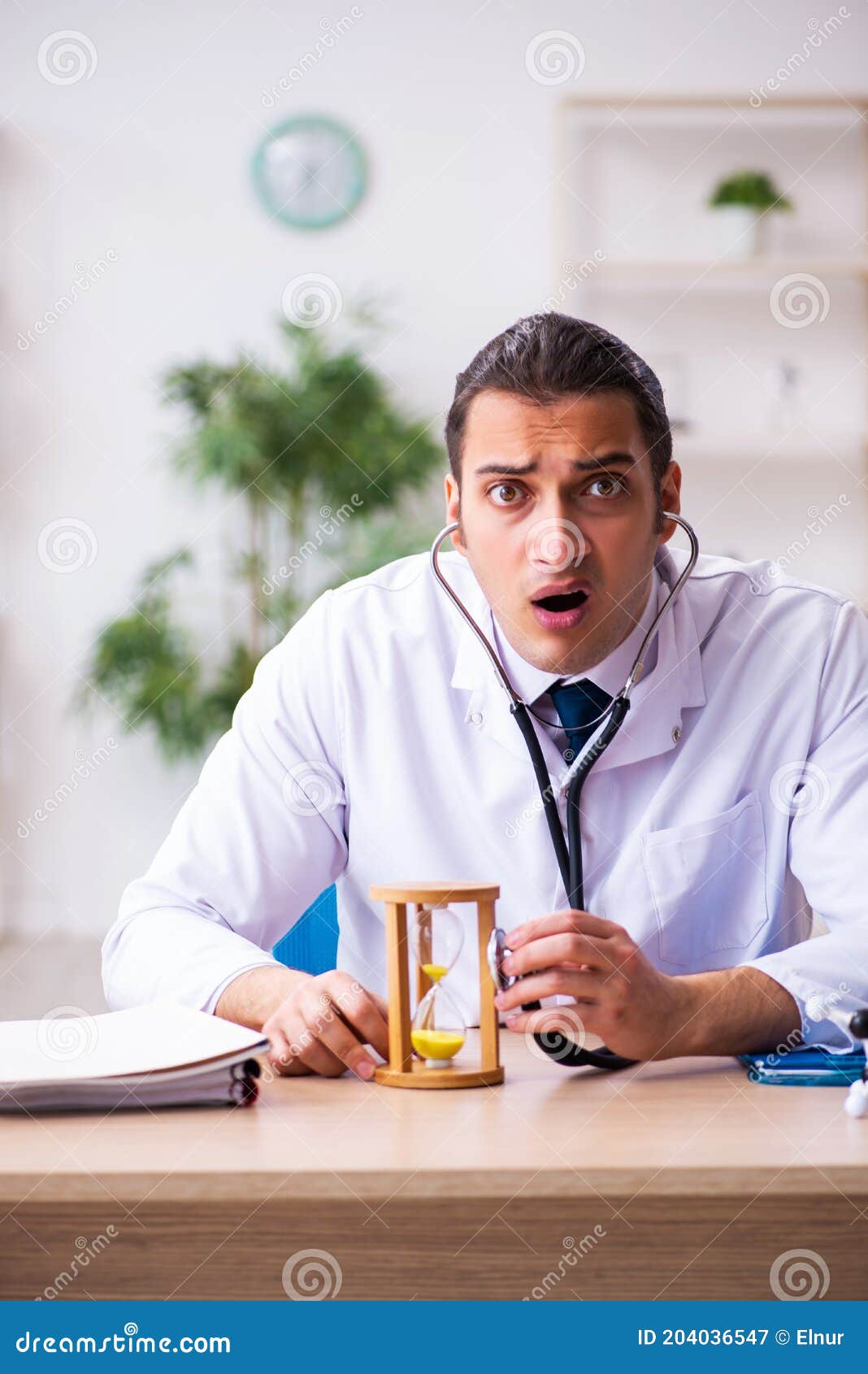 Young Male Doctor in Time Management Concept Stock Image - Image of ...