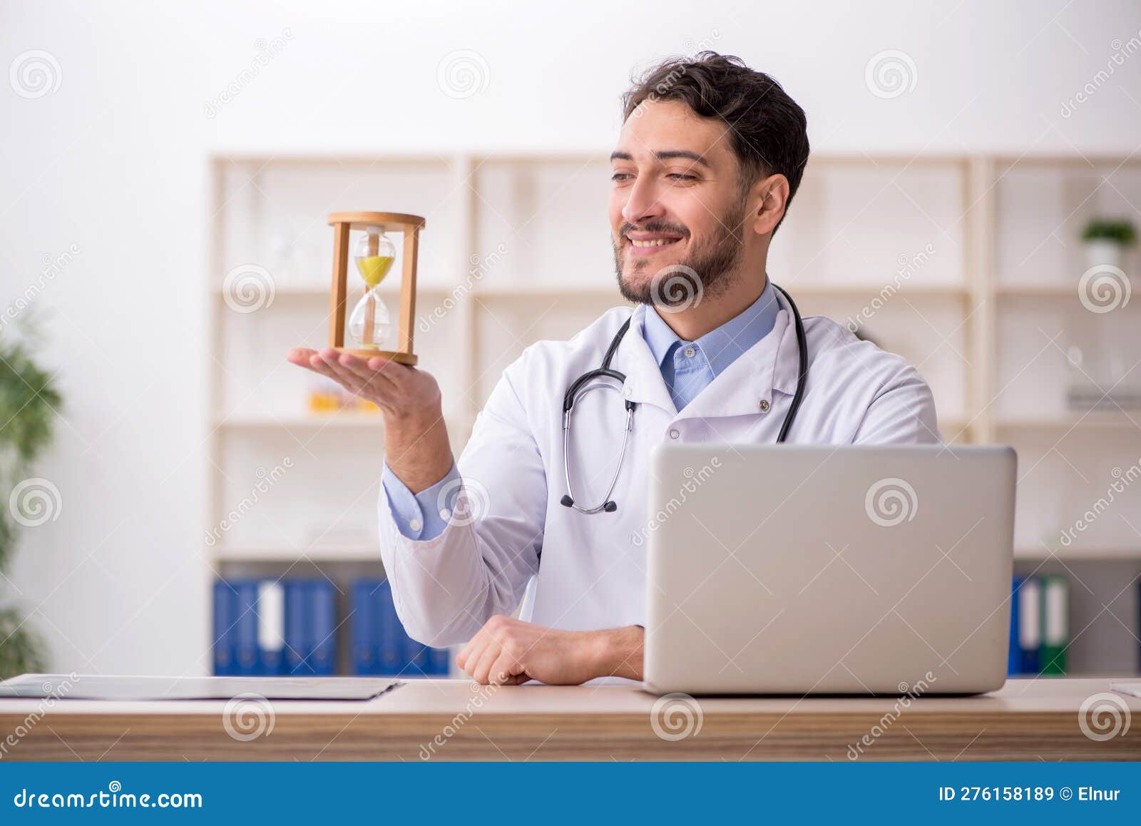 Young Male Doctor in Time Management Concept Stock Image - Image of ...