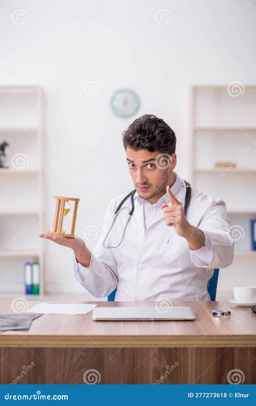 Young Male Doctor in Time Management Concept Stock Photo - Image of ...