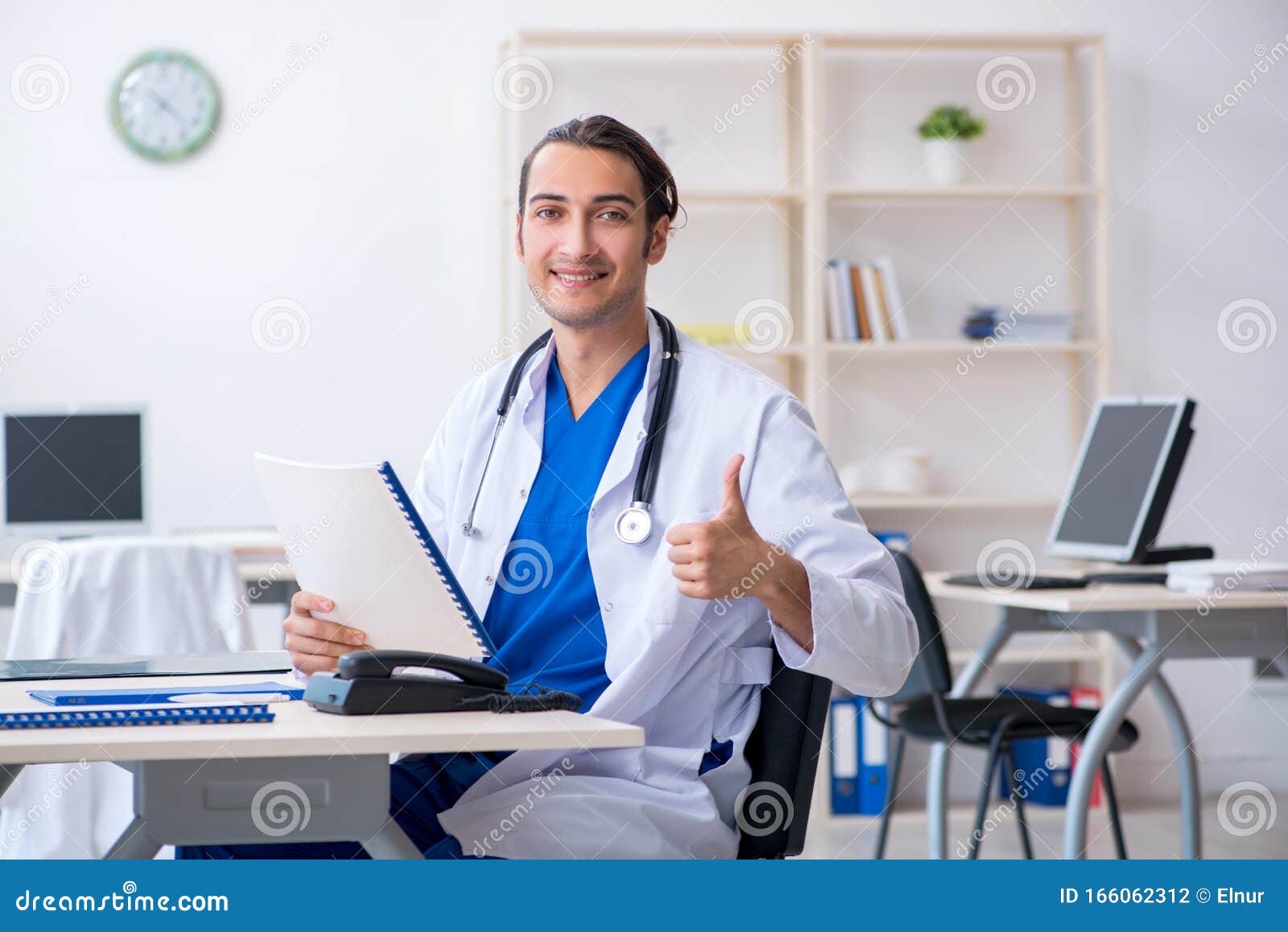 Young Male Doctor Working in the Clinic Stock Photo - Image of clinic ...