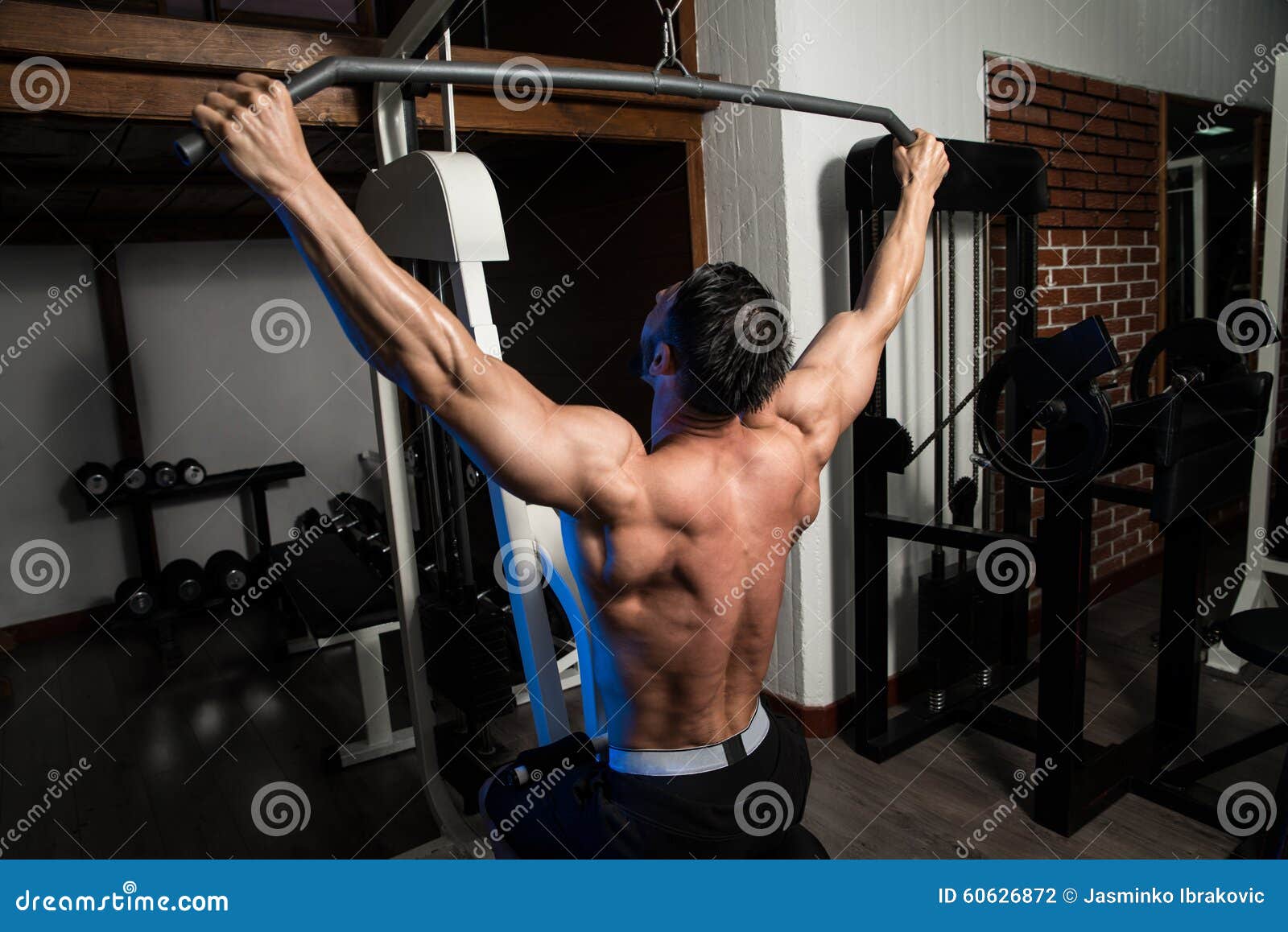 Young Male Doing Back Exercises in the Gym Stock Photo - Image of ...