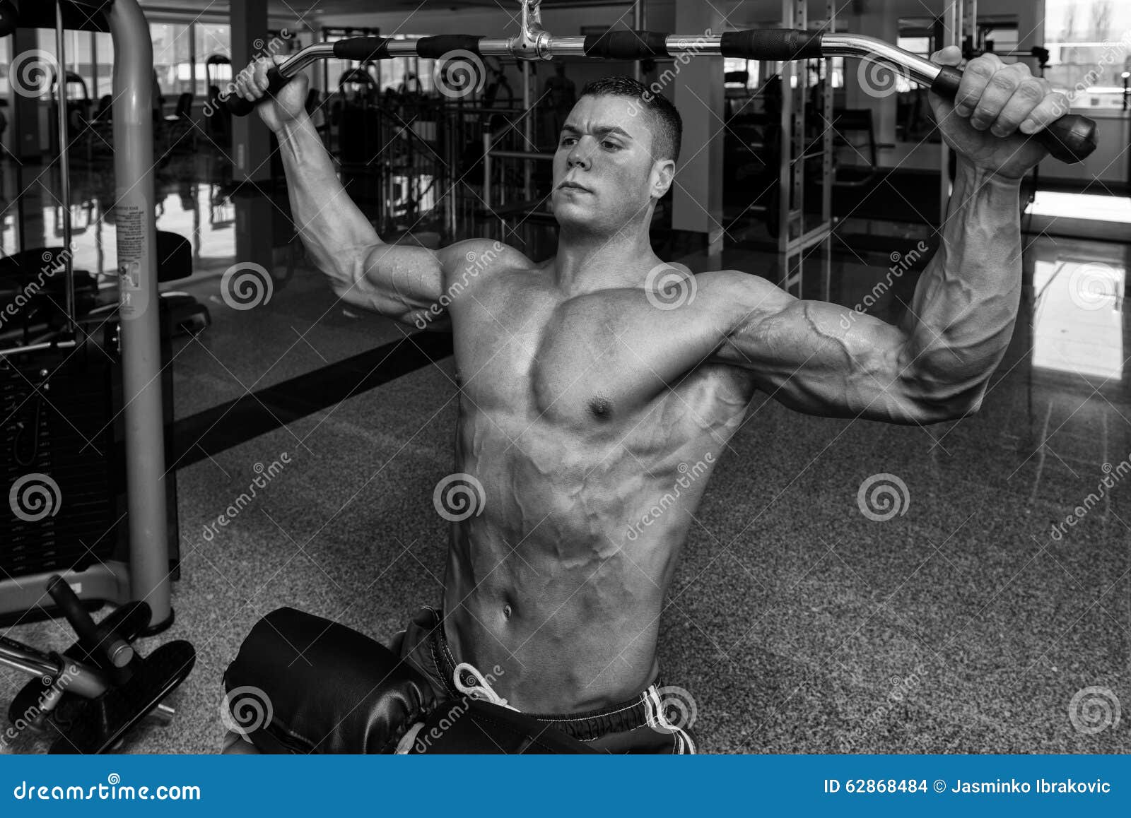 Young Male Doing Back Exercises in the Gym Stock Photo - Image of ...