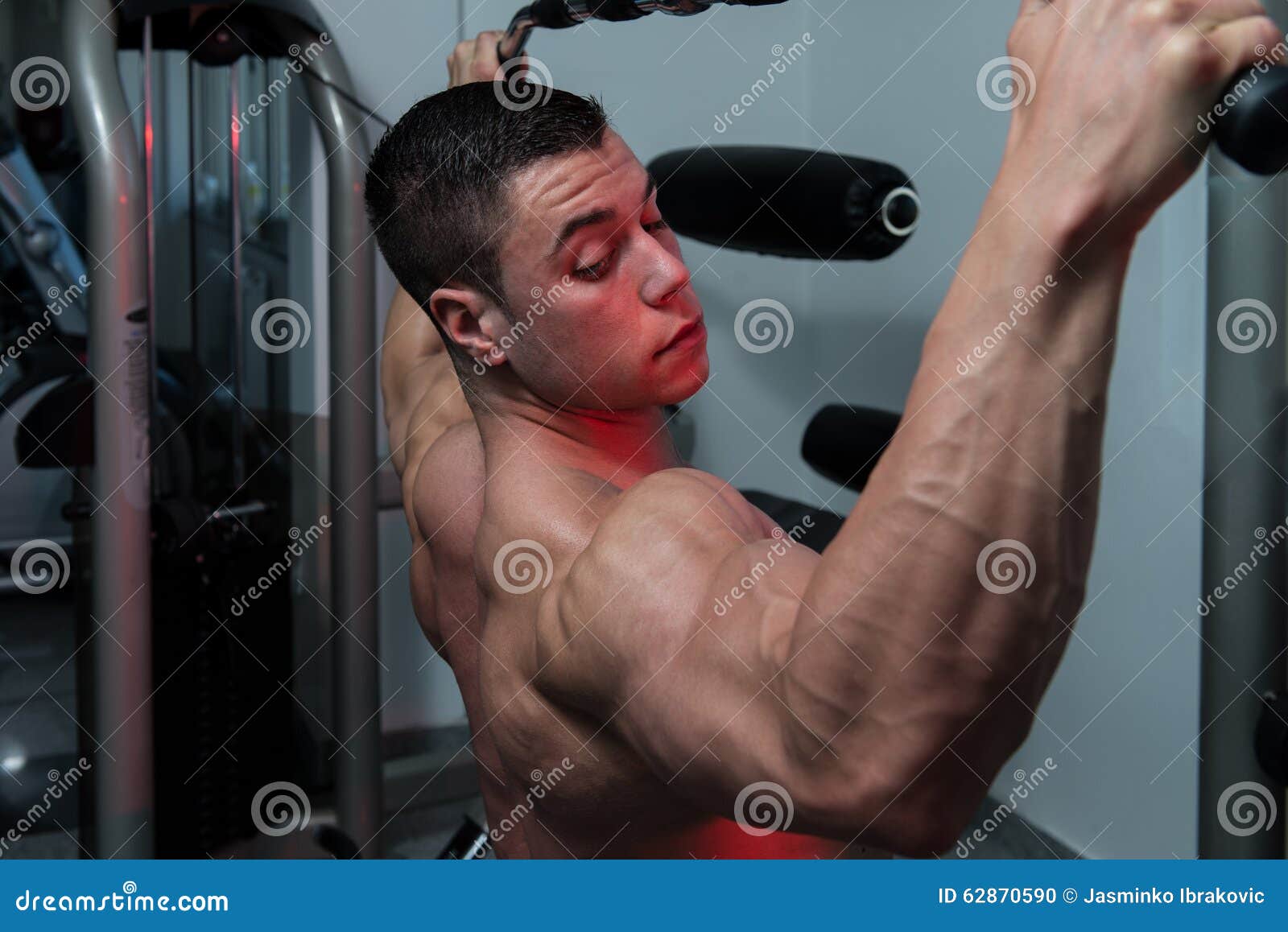 Young Male Doing Back Exercises in the Gym Stock Photo - Image of ...