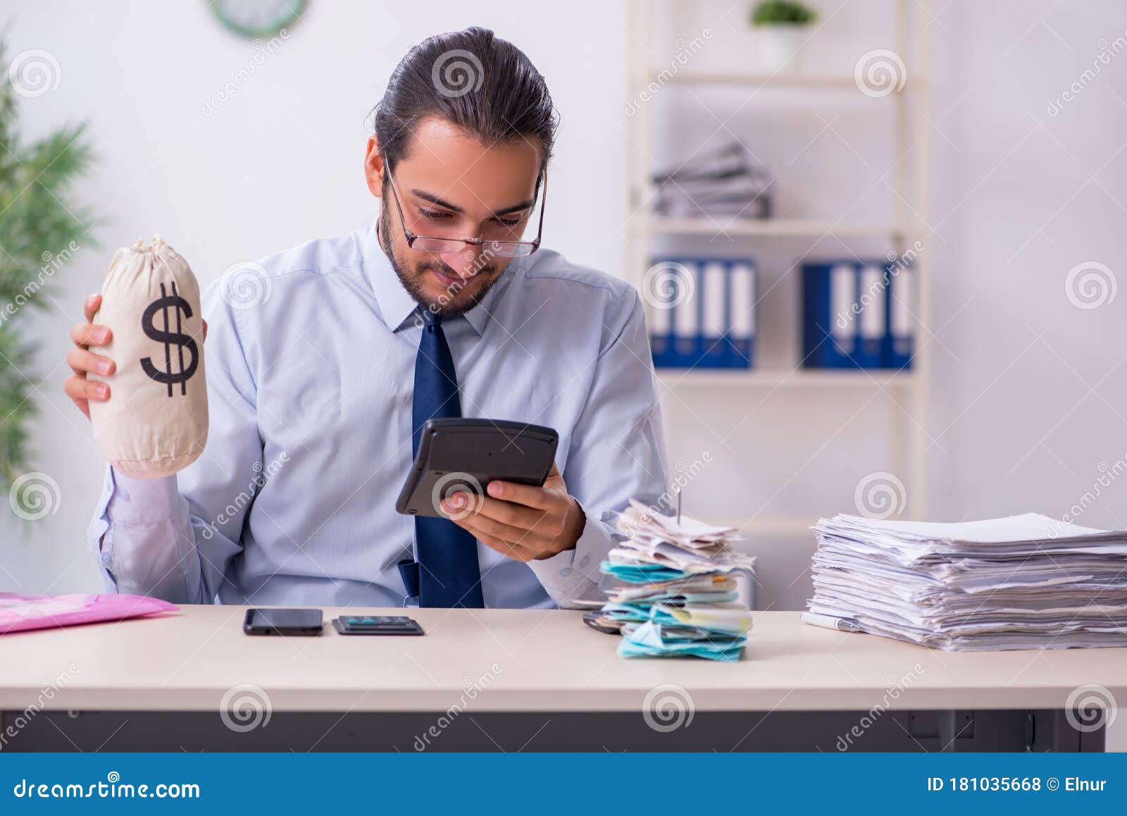 Young Male Employee in Budget Planning Concept Stock Photo - Image of ...