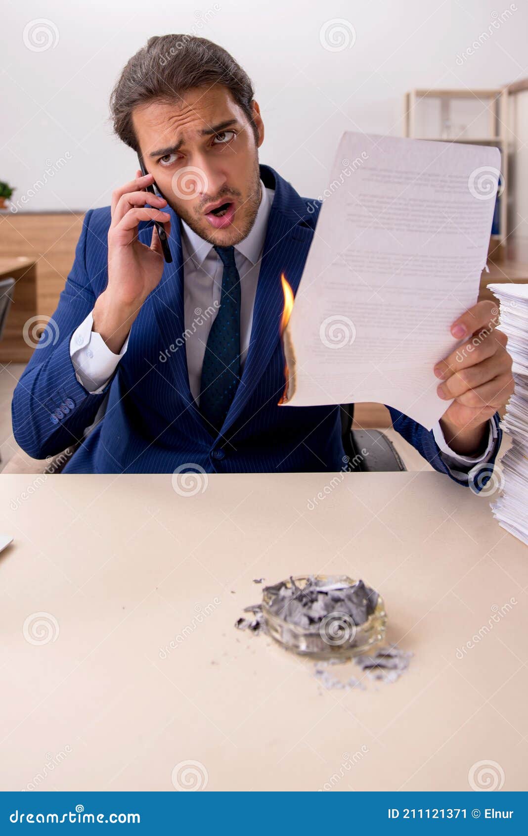 Young Male Employee Burning Papers in the Office Stock Image - Image of ...