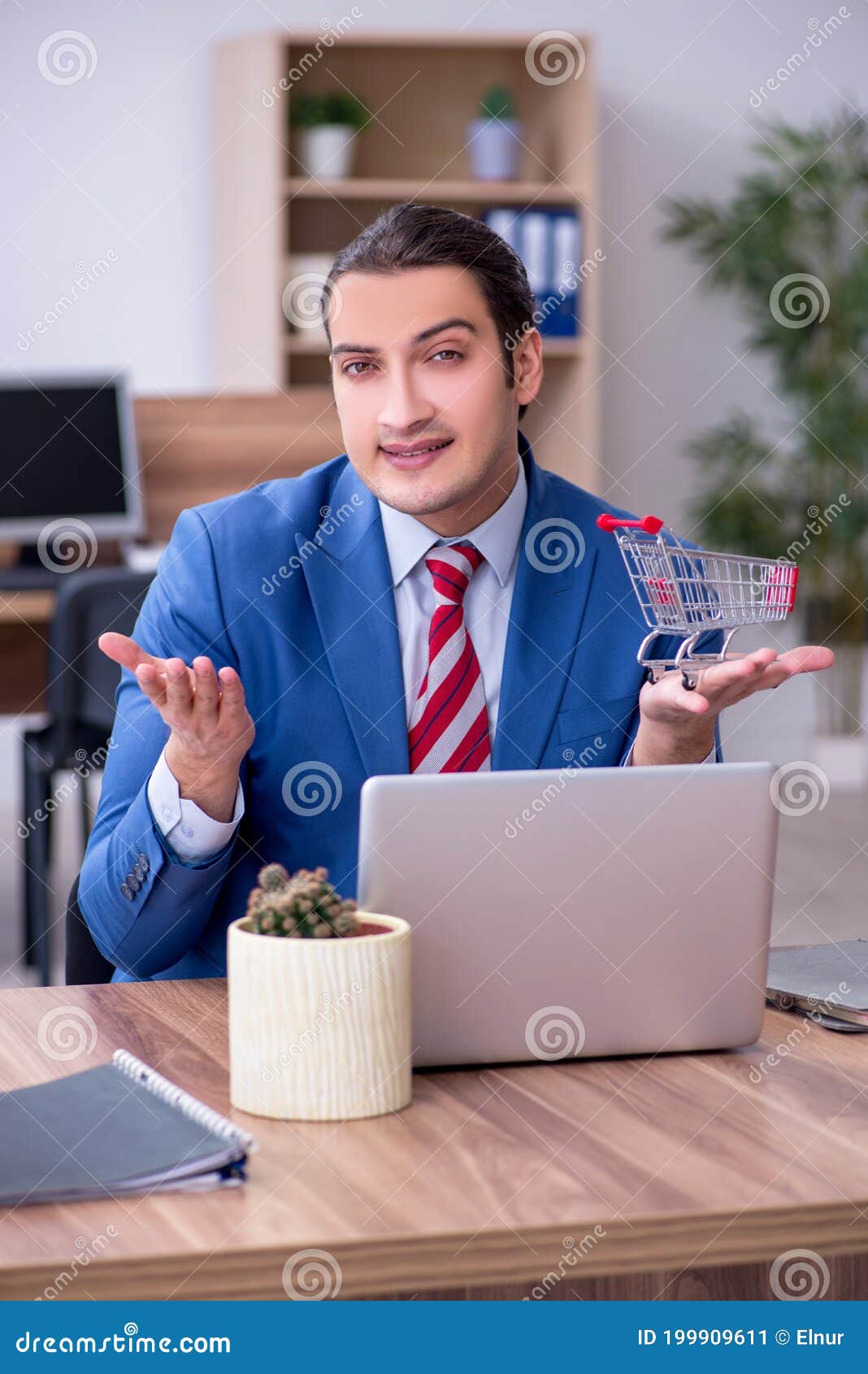 Young Male Employee in E-commerce Concept in the Office Stock Image ...