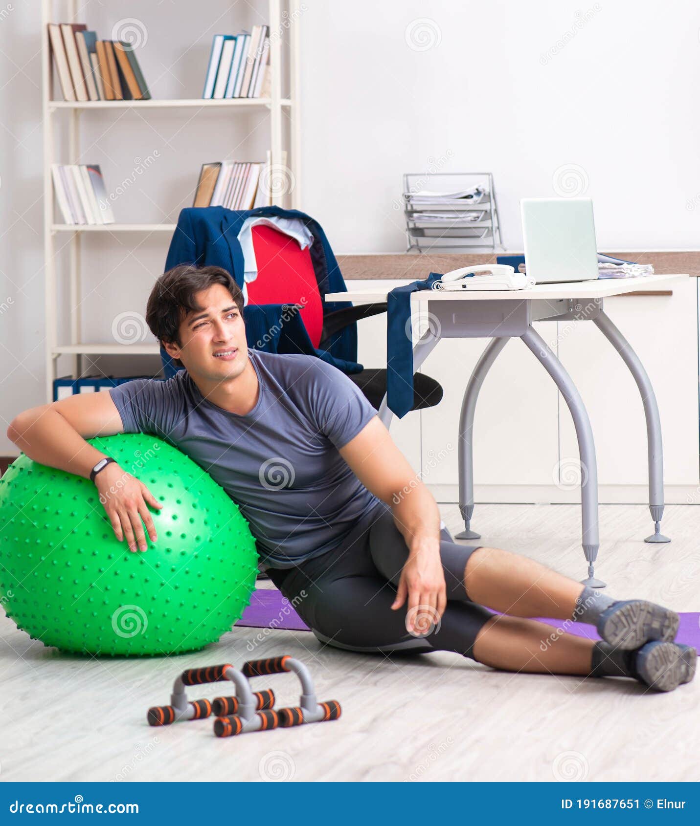 Young Male Employee Exercising in the Office Stock Image - Image of ...