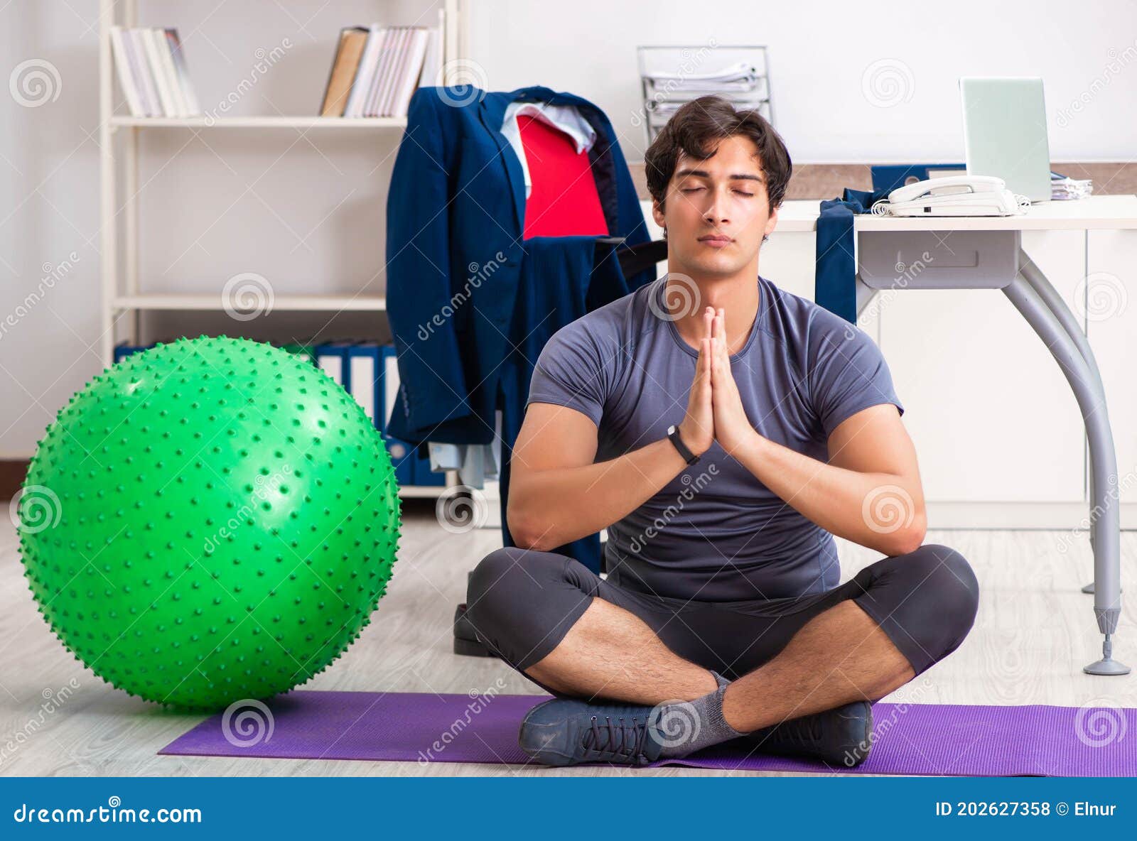 Young Male Employee Exercising in the Office Stock Photo - Image of ...